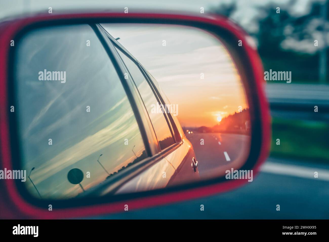Sunset reflection in the rear view mirror Stock Photo - Alamy