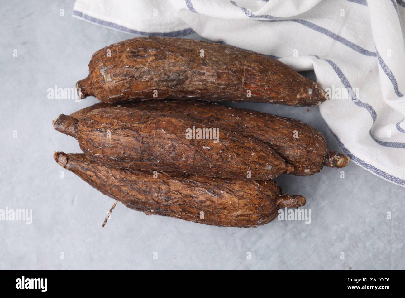 Fresh cassava roots on grey table, top view Stock Photo - Alamy