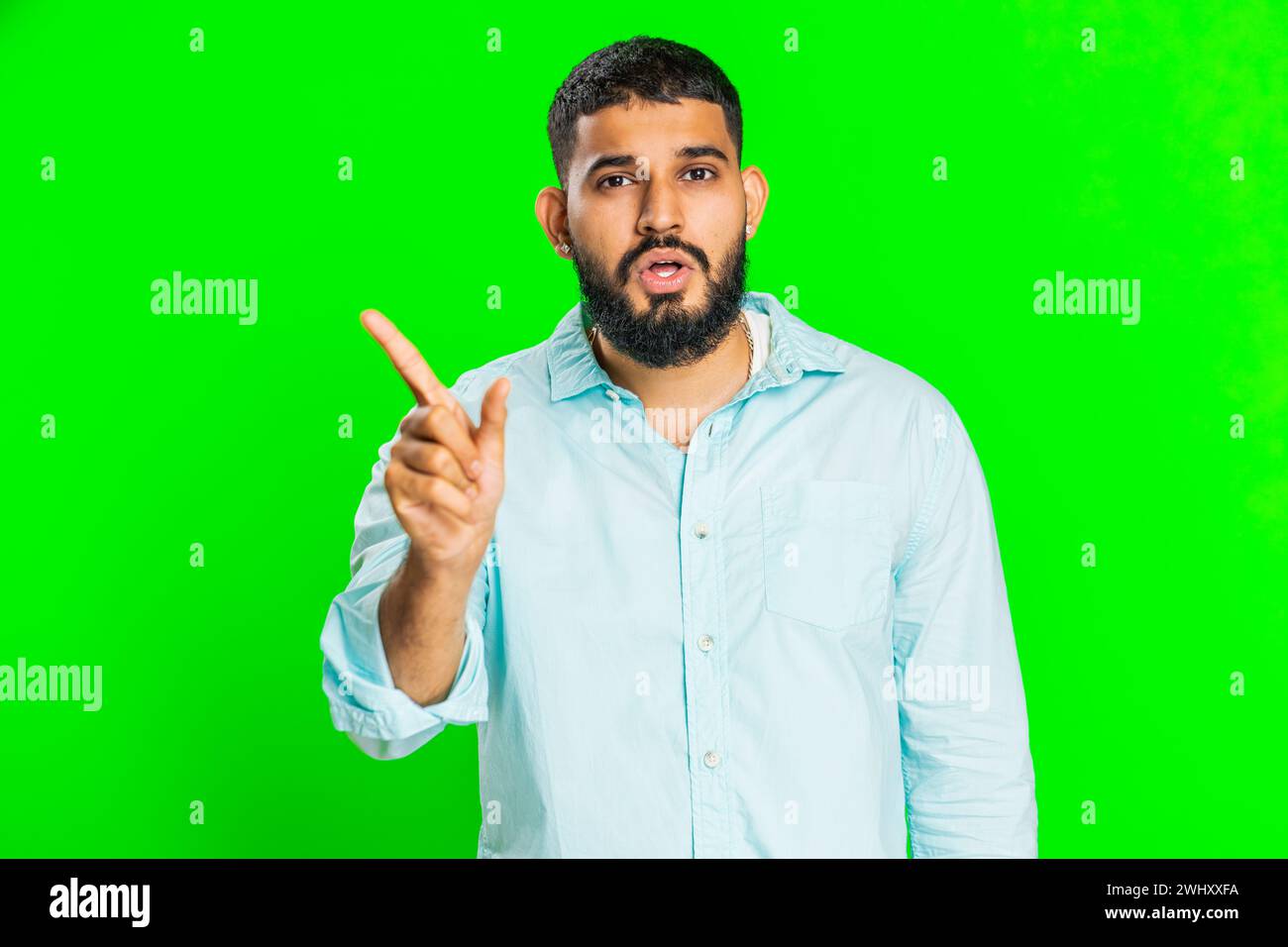 Indian young man shakes finger and saying no, be careful, scolding and ...