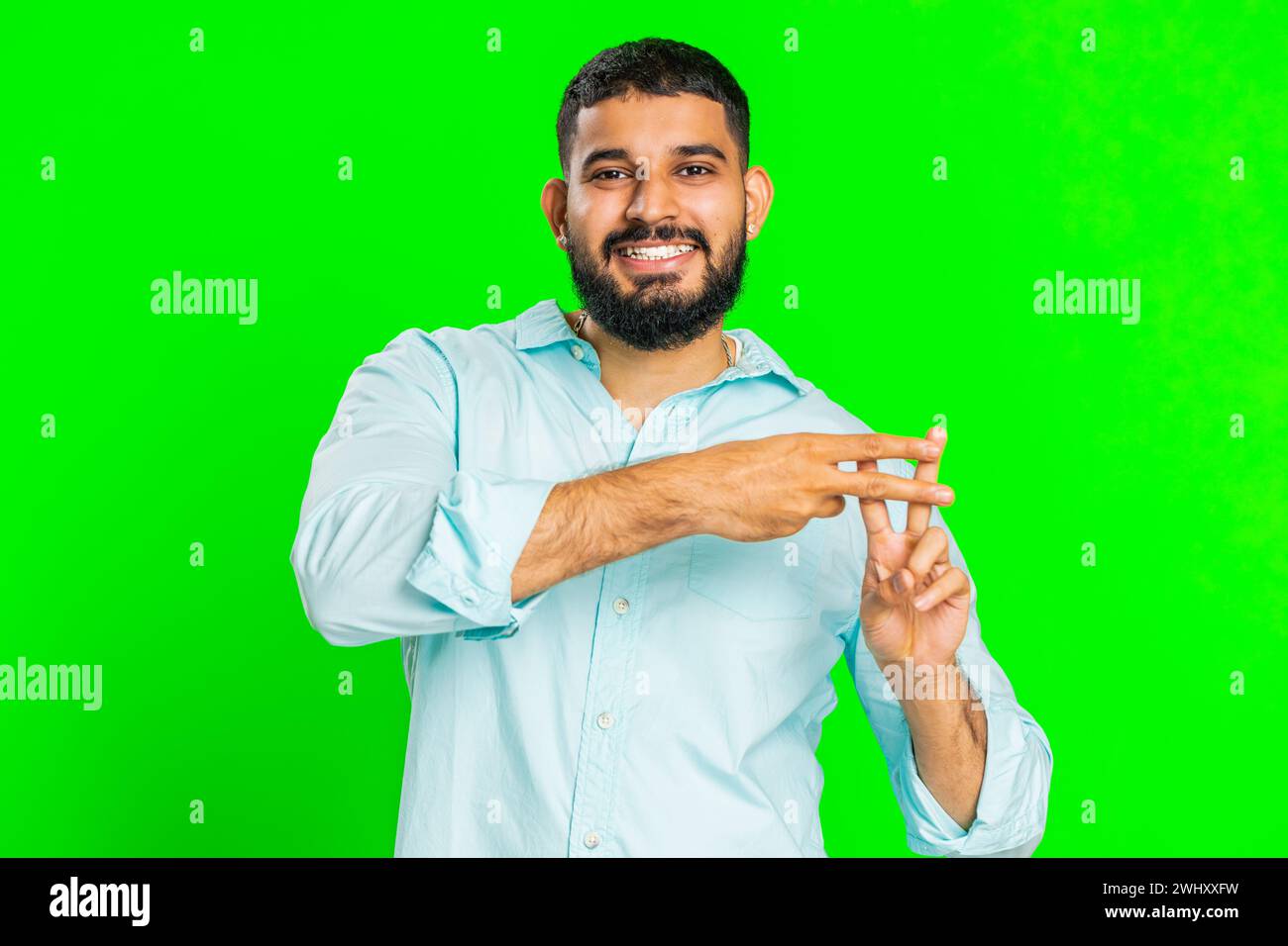Hashtag. Indian man showing cross symbol with fingers, likes tagged ...