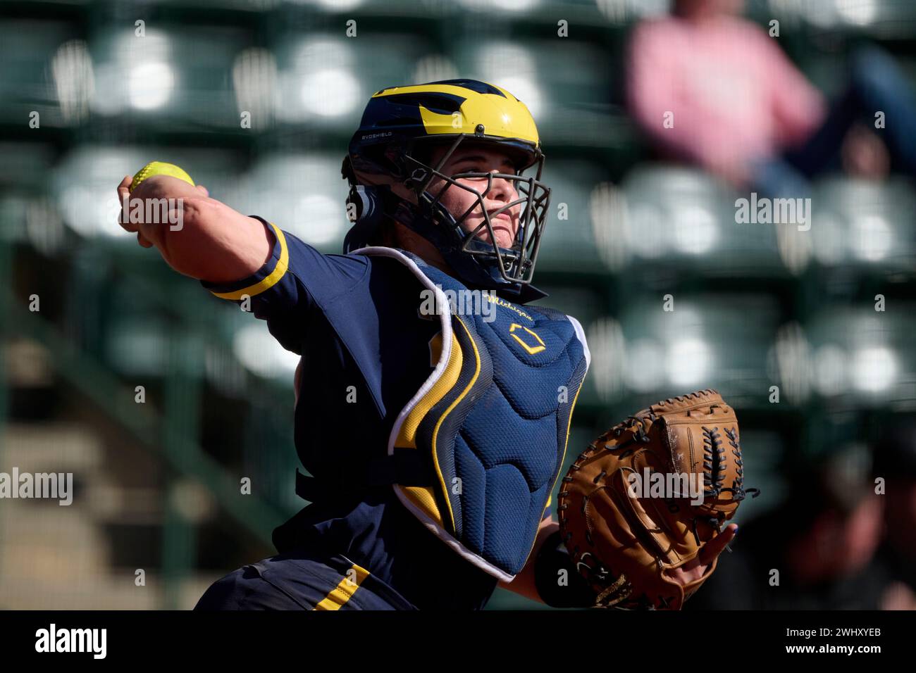 Michigan Wolverines catcher Lilly Vallimont (20) throwing during an ...