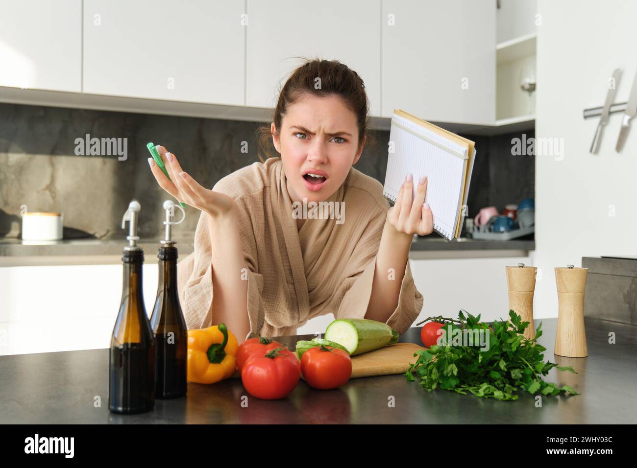 Angry woman chopping vegetables hi-res stock photography and images - Alamy