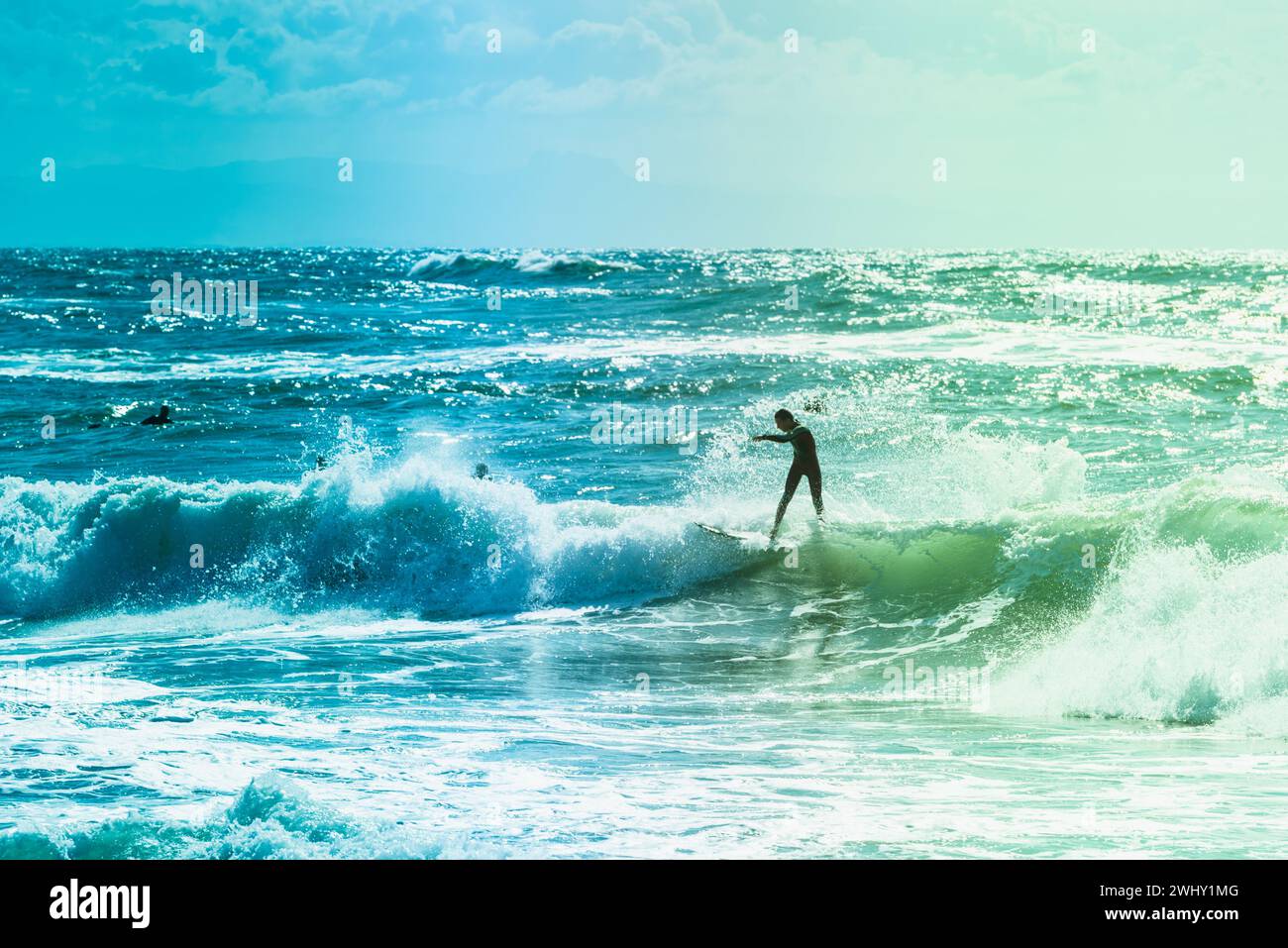 Surfers on waves hi-res stock photography and images - Alamy