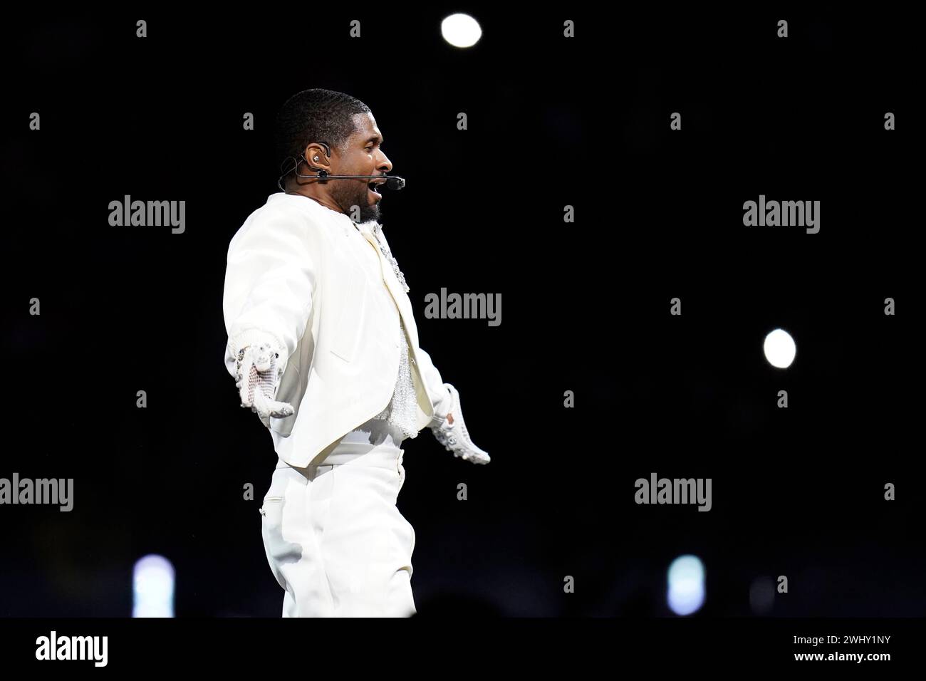 Usher performs during the NFL Super Bowl 58 football game Sunday, Feb ...