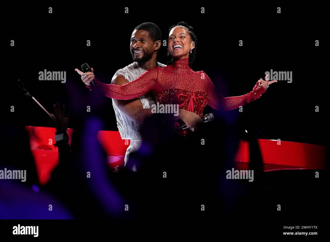 Usher, left, and Alicia Keys perform during halftime of the NFL Super ...