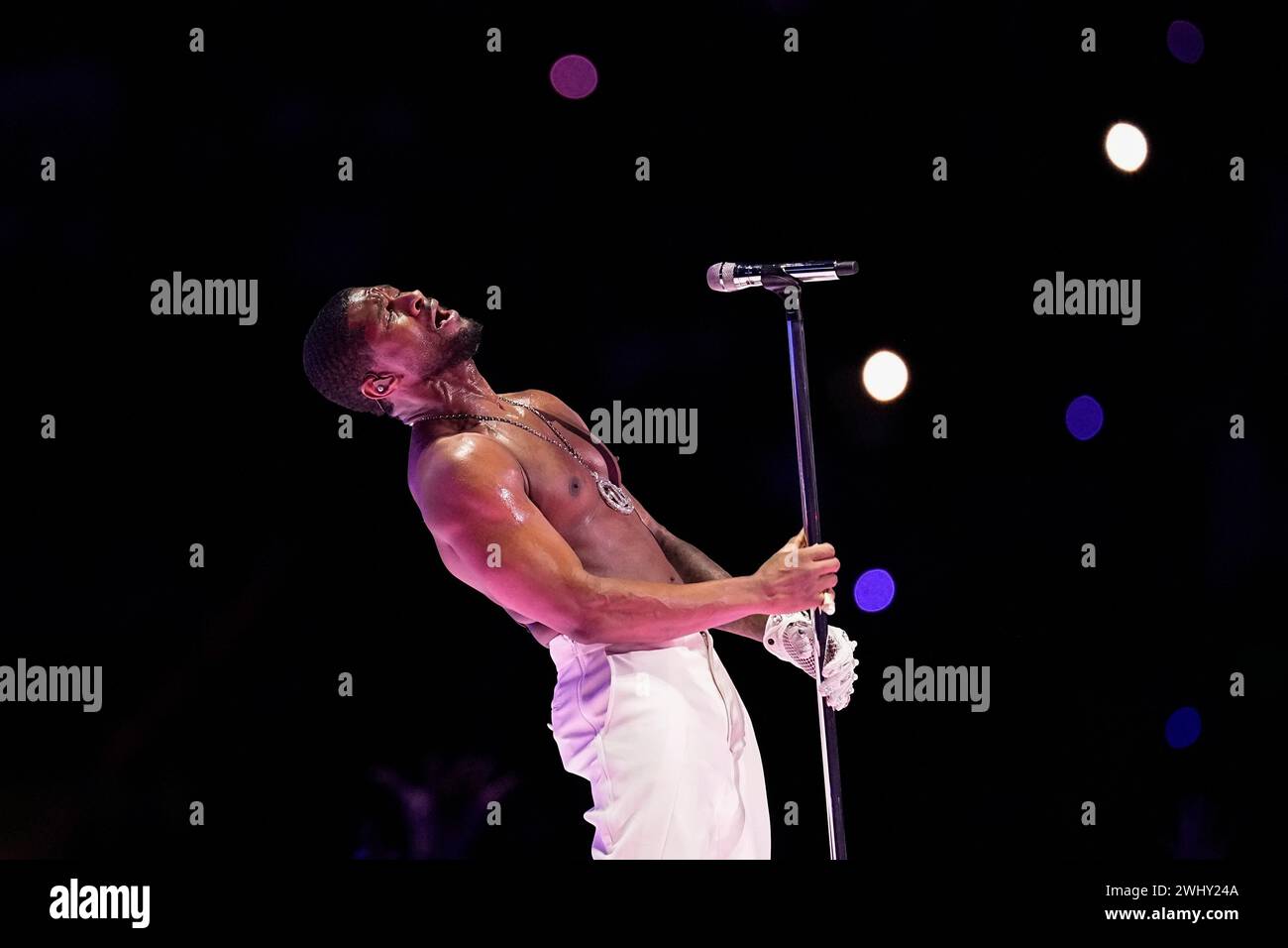 Usher performs during halftime of the NFL Super Bowl 58 football game ...