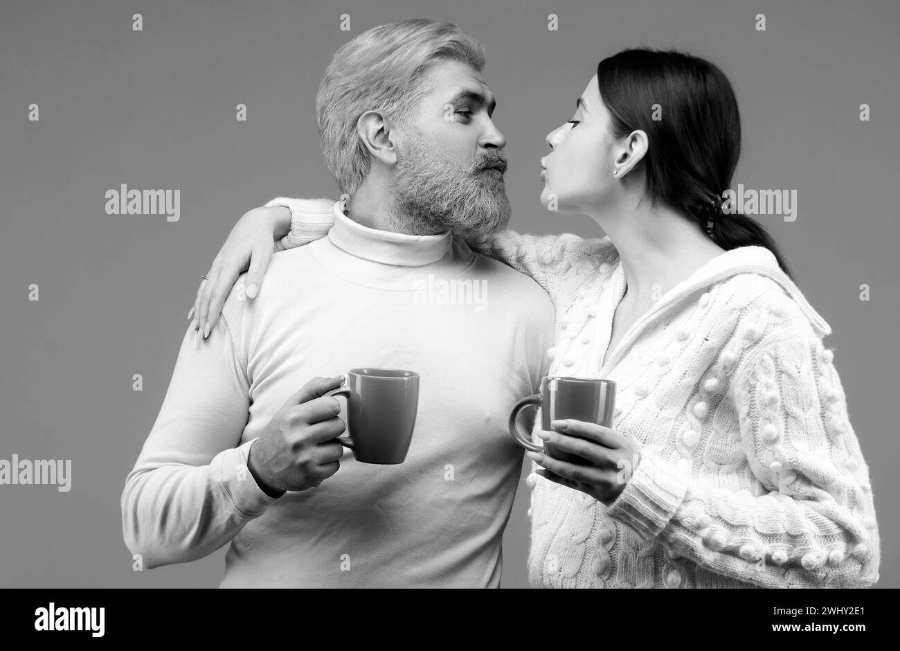 Happy cozy kiss couple at morning. Family enjoying usual evening ...