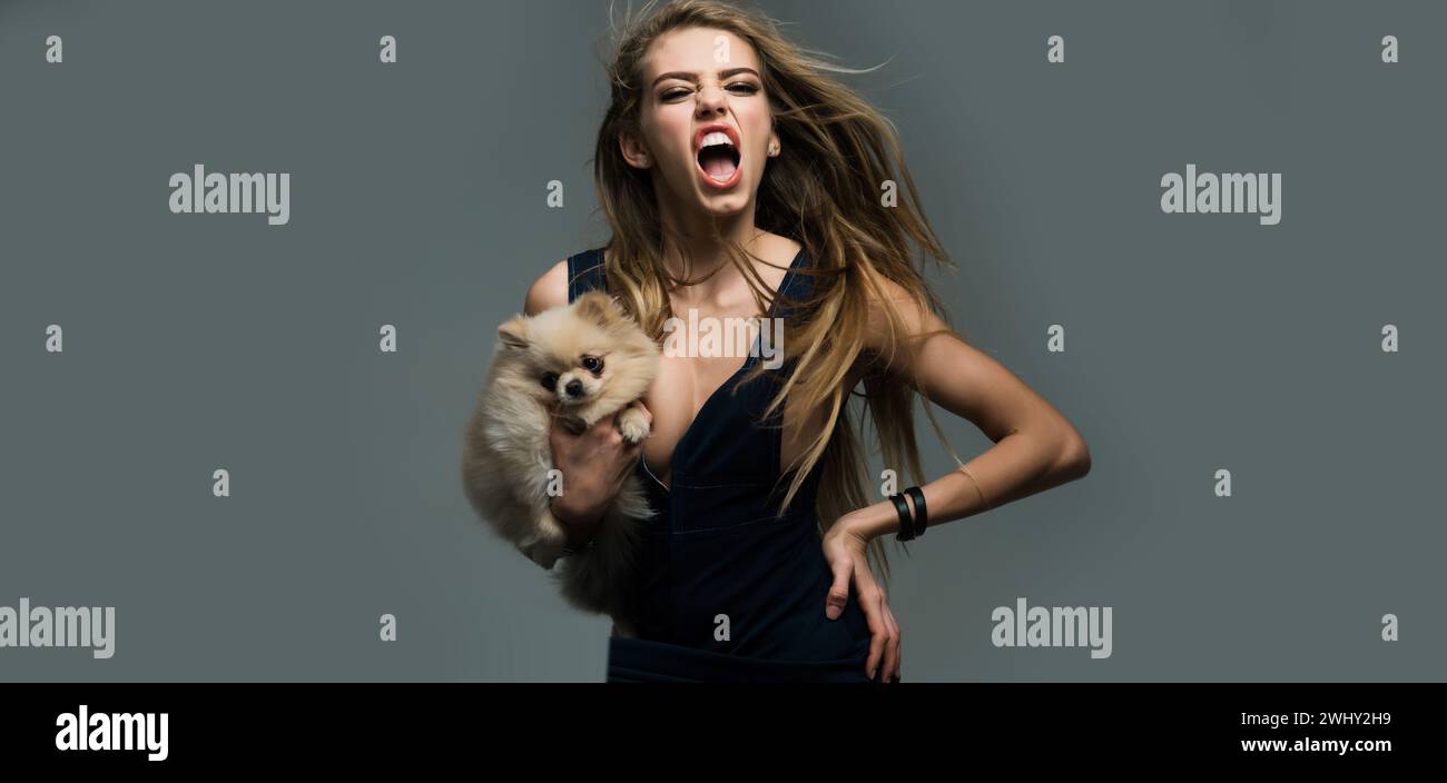 Young woman with pet dog screaming and shouting. Human emotions, facial ...