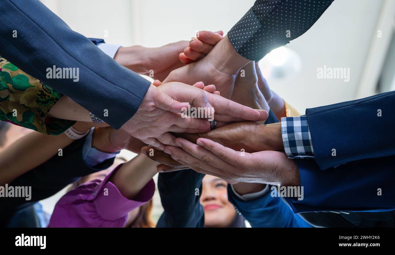 Team, teamwork, and unity concept. Diverse team putting hands together. Group of diverse ...
