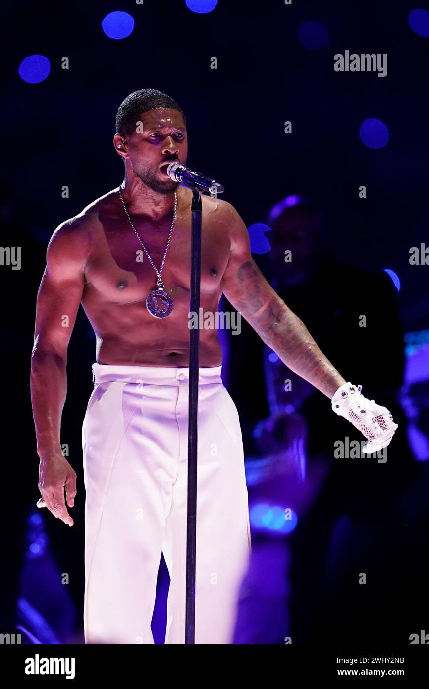 Usher performs during halftime of the NFL Super Bowl 58 football game ...