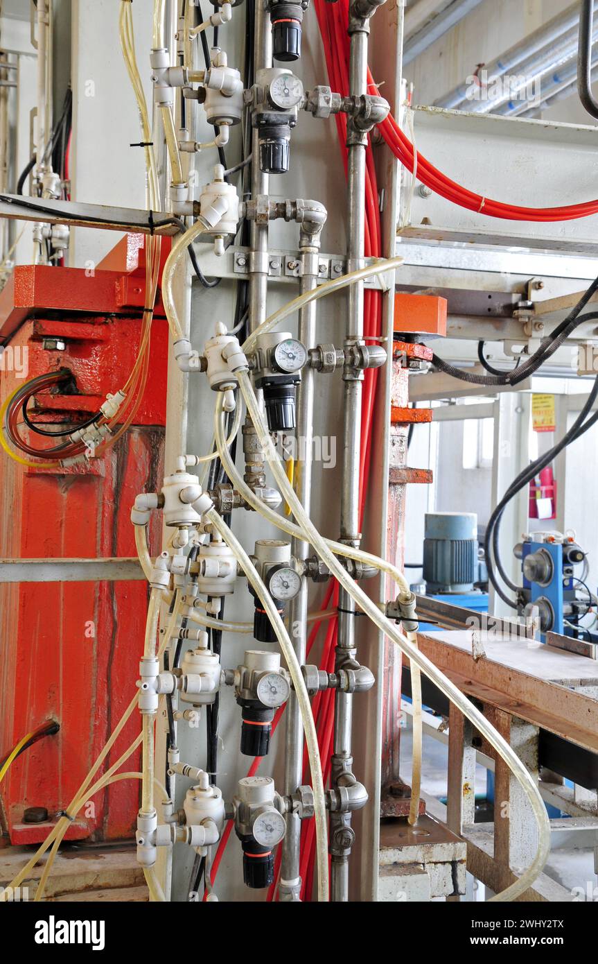 Shiny industrial equipment and piping, wiring and other connection ...