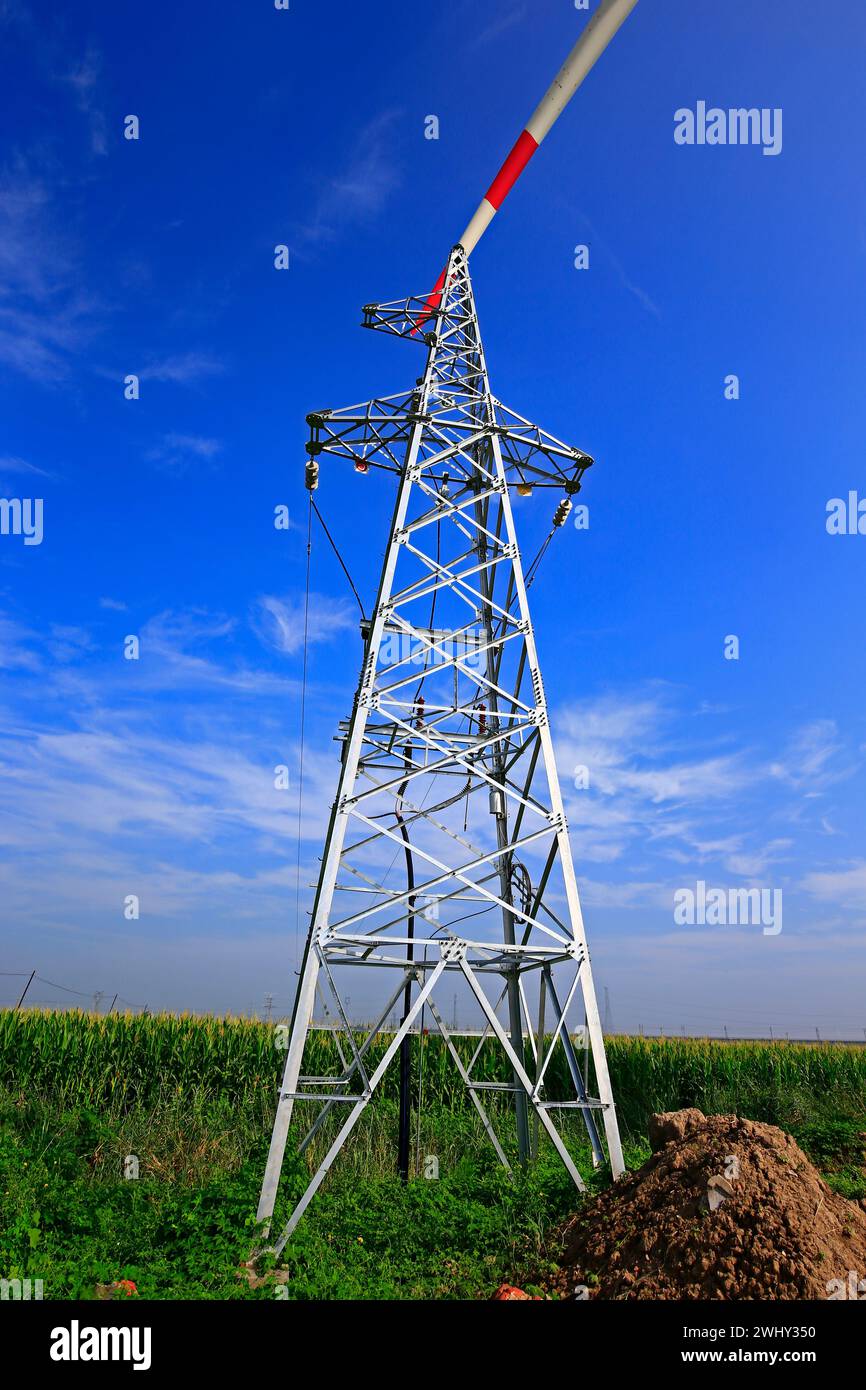 Pylon, high-voltage tower sky background Stock Photo - Alamy