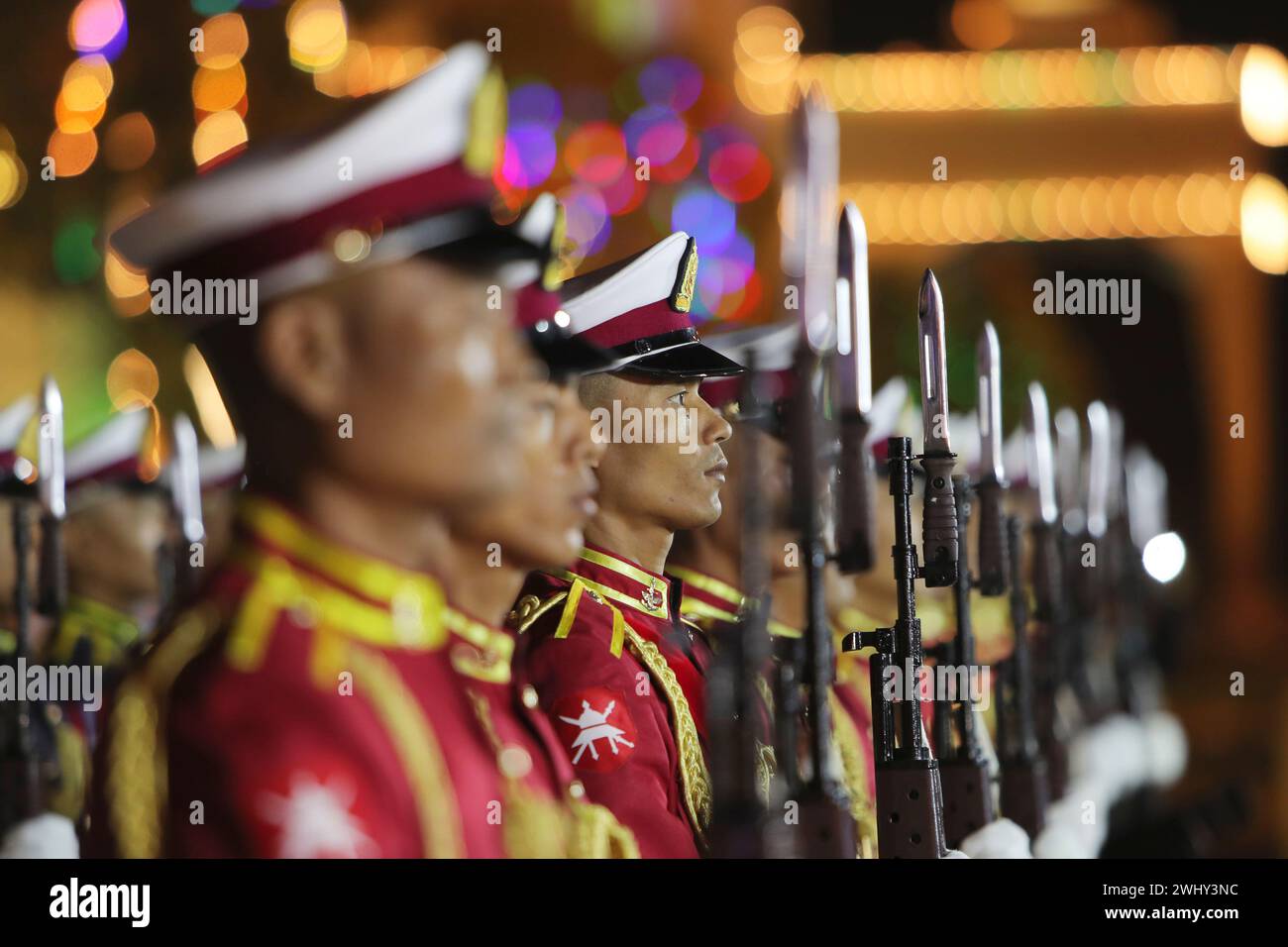 Members of the honor guard stand at attention during a ceremony to mark ...