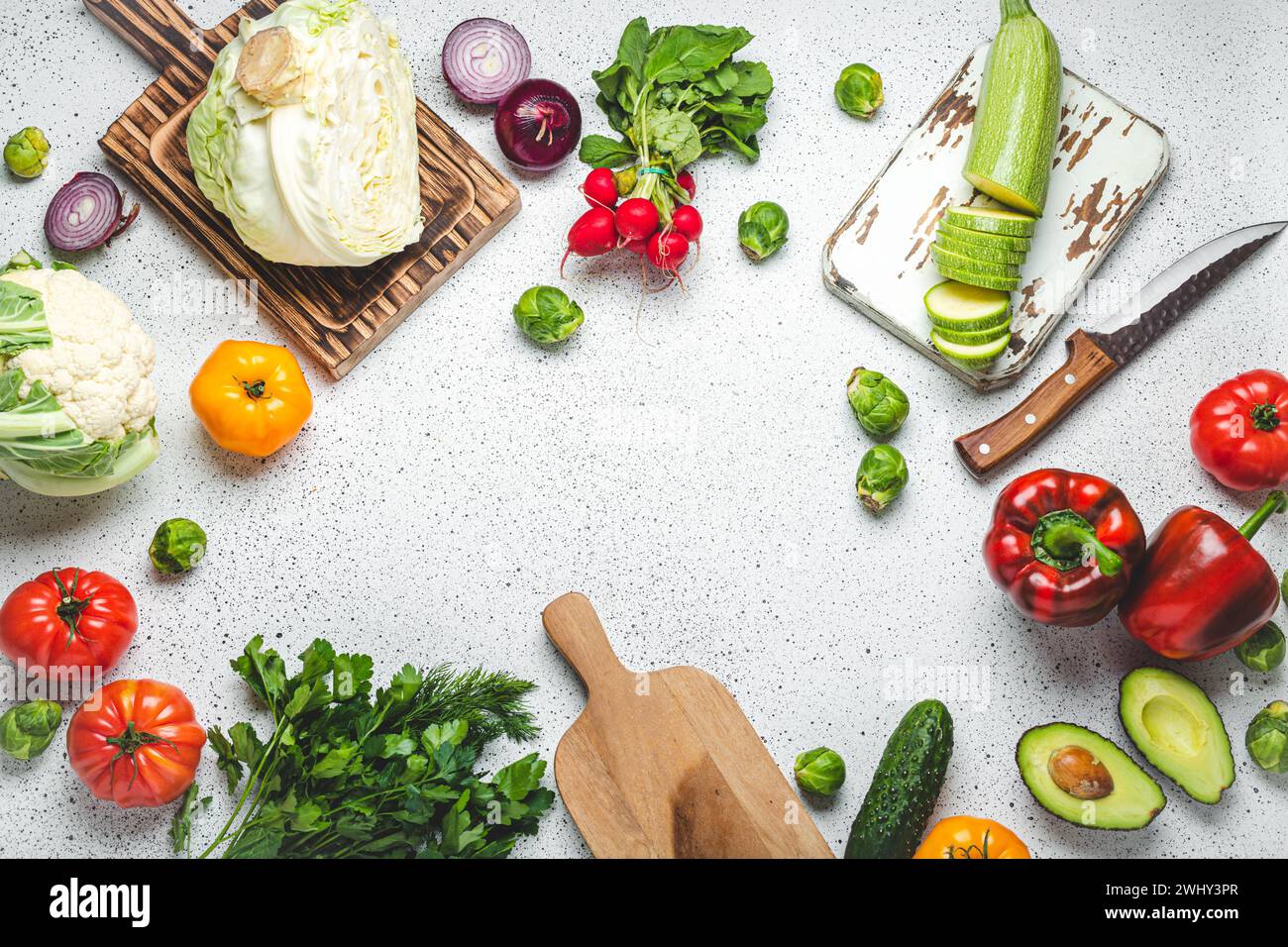 Fresh various vegetables, wooden cutting boards and knife on white ...