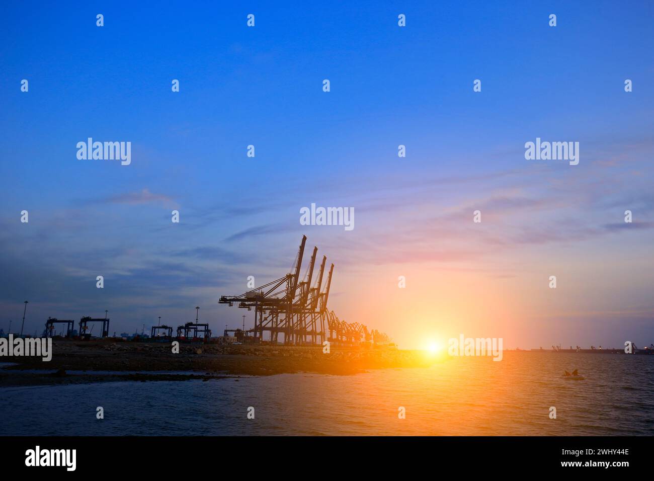Port crane unloading container ships Stock Photo - Alamy