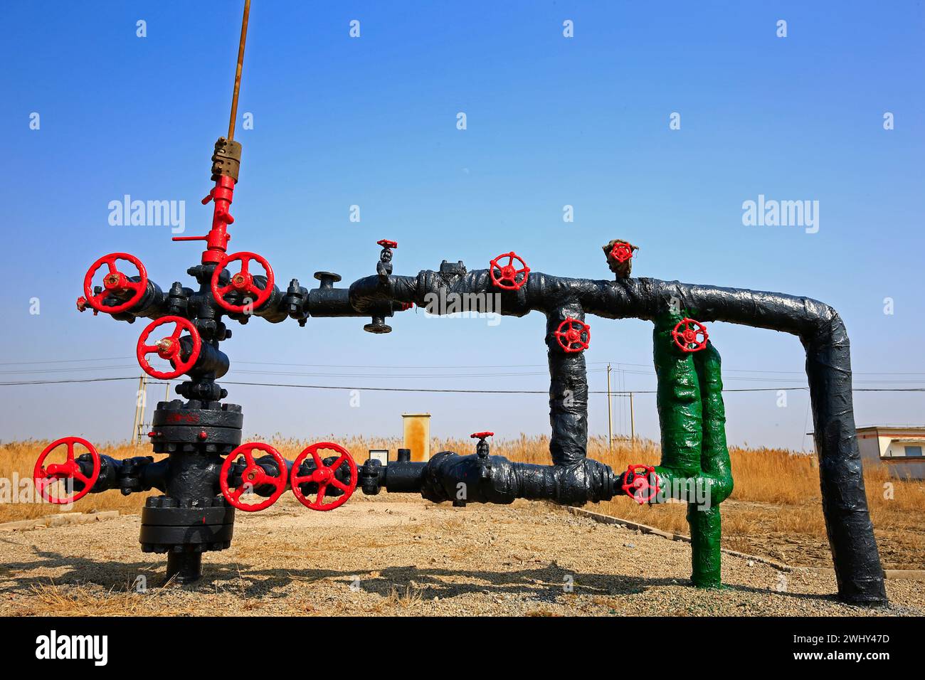Oil pipes and valves Stock Photo - Alamy