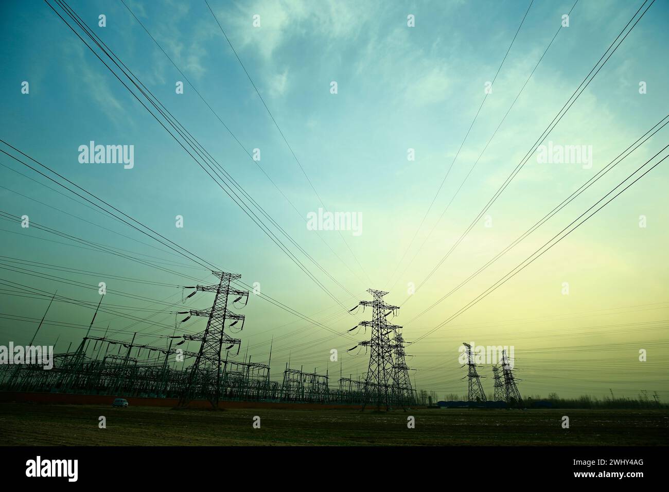 Pylon, high-voltage tower sky background Stock Photo - Alamy