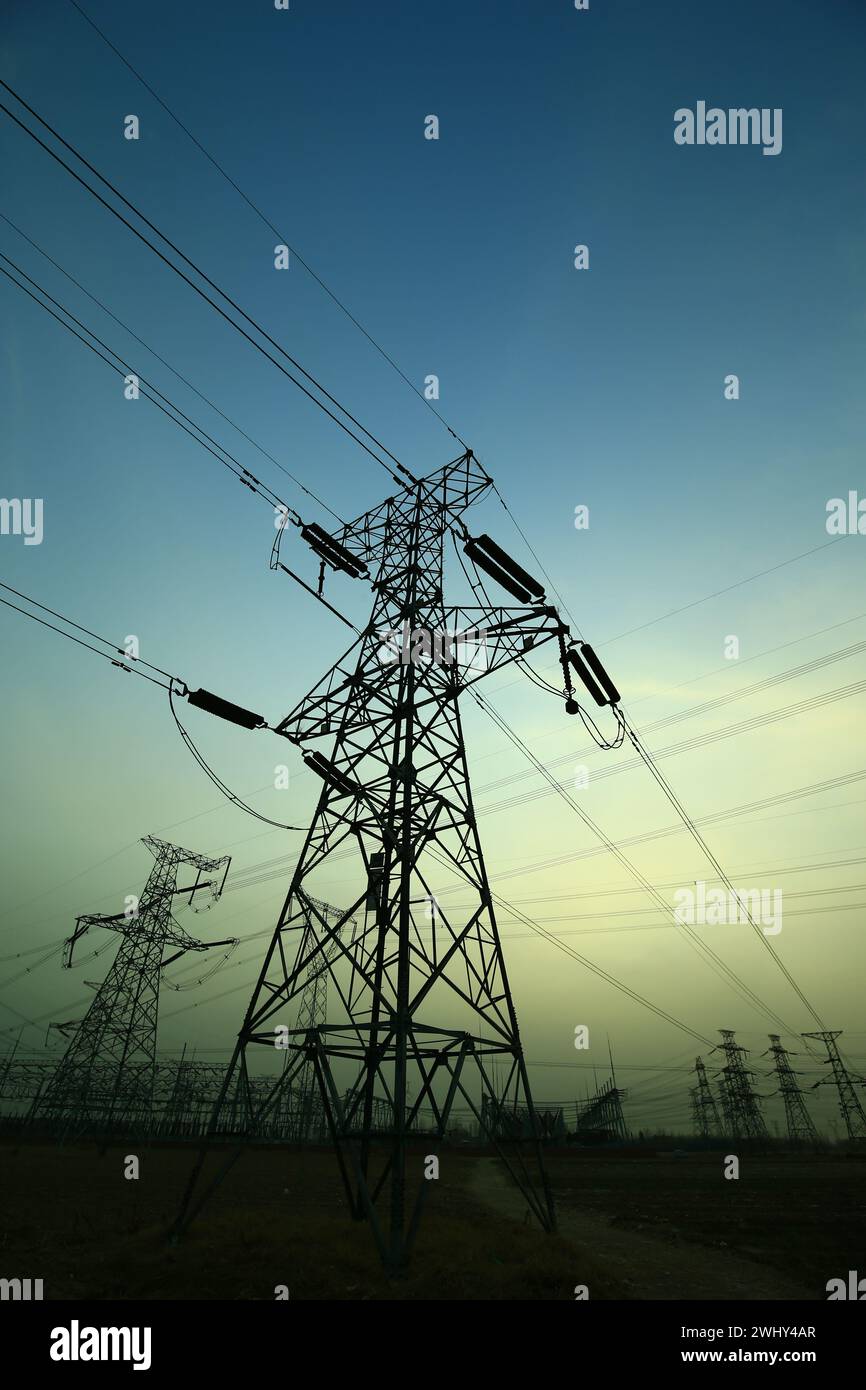 Pylon, high-voltage tower sky background Stock Photo - Alamy