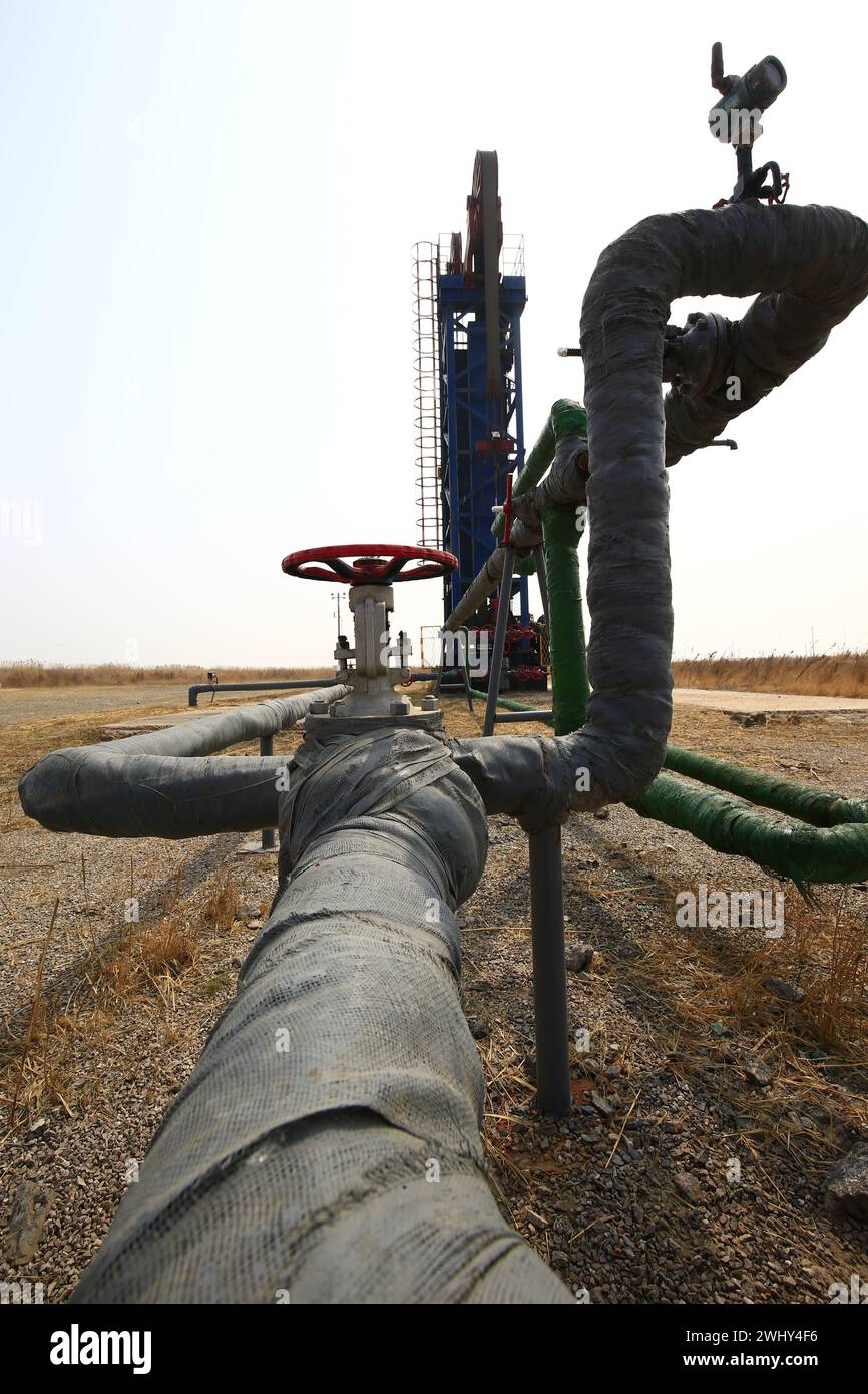 Oil pipes and valves Stock Photo - Alamy
