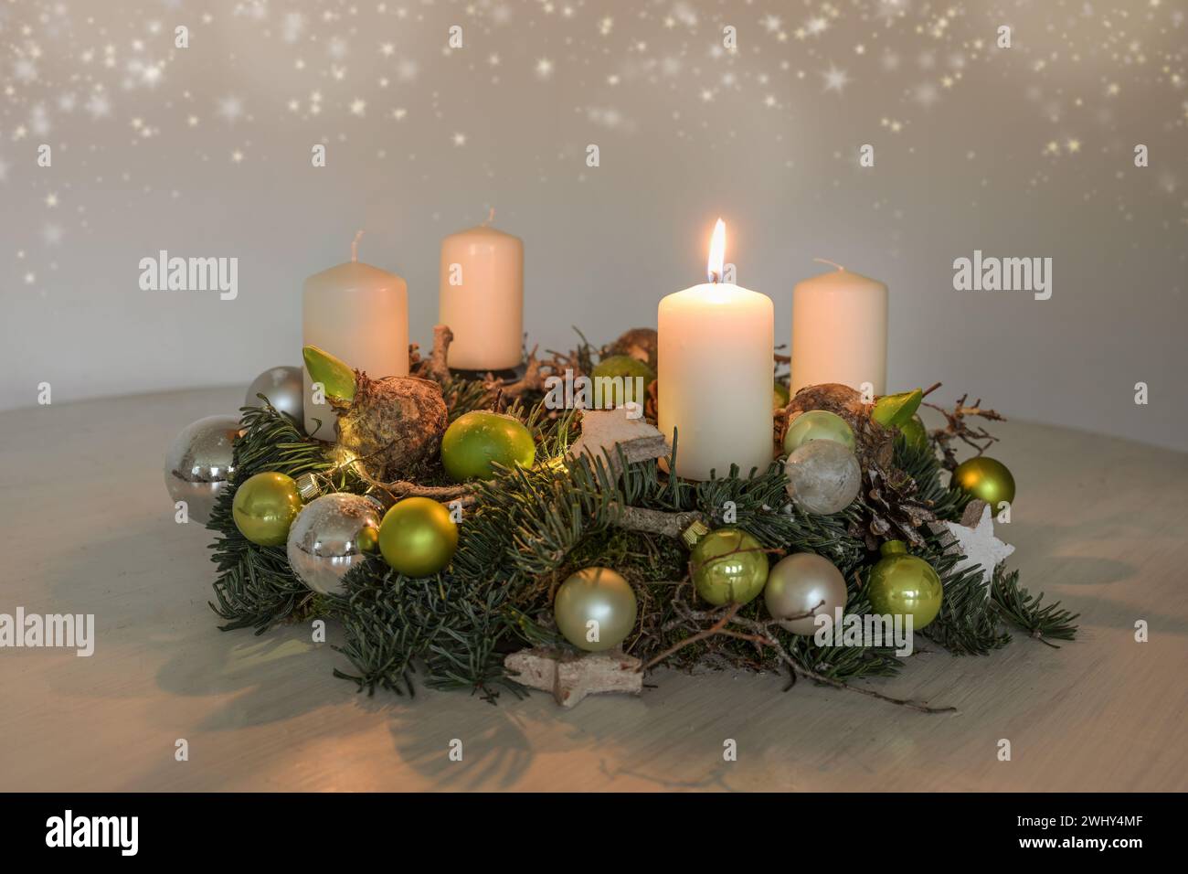 First Advent, wreath with one burning white candle and green Christmas ...