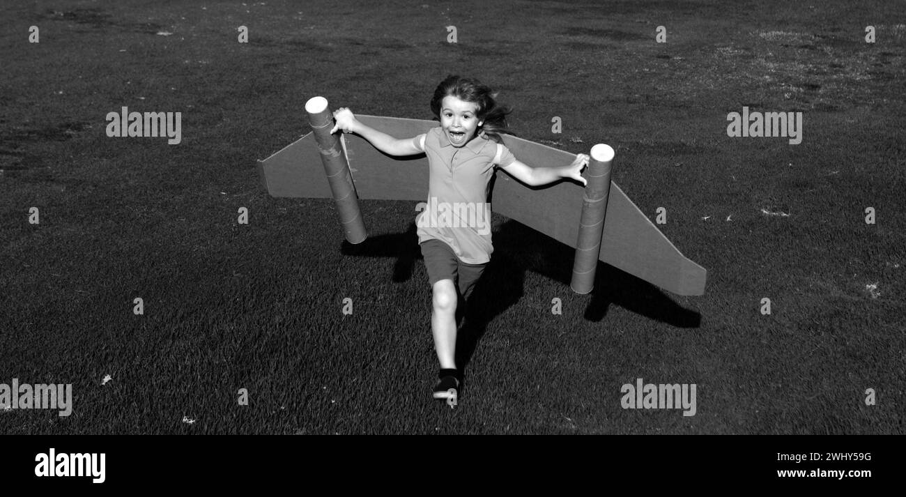 Happy child playing with toy jetpack. Kid pilot having fun outdoor ...