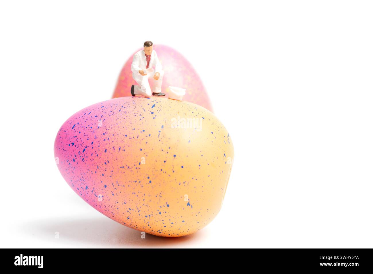 Miniature people painting Easter-eggs Stock Photo - Alamy