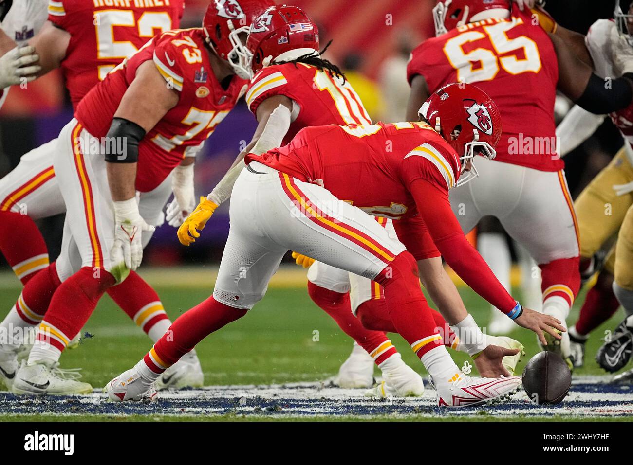 Kansas City Chiefs quarterback Patrick Mahomes (15) recovers his ...