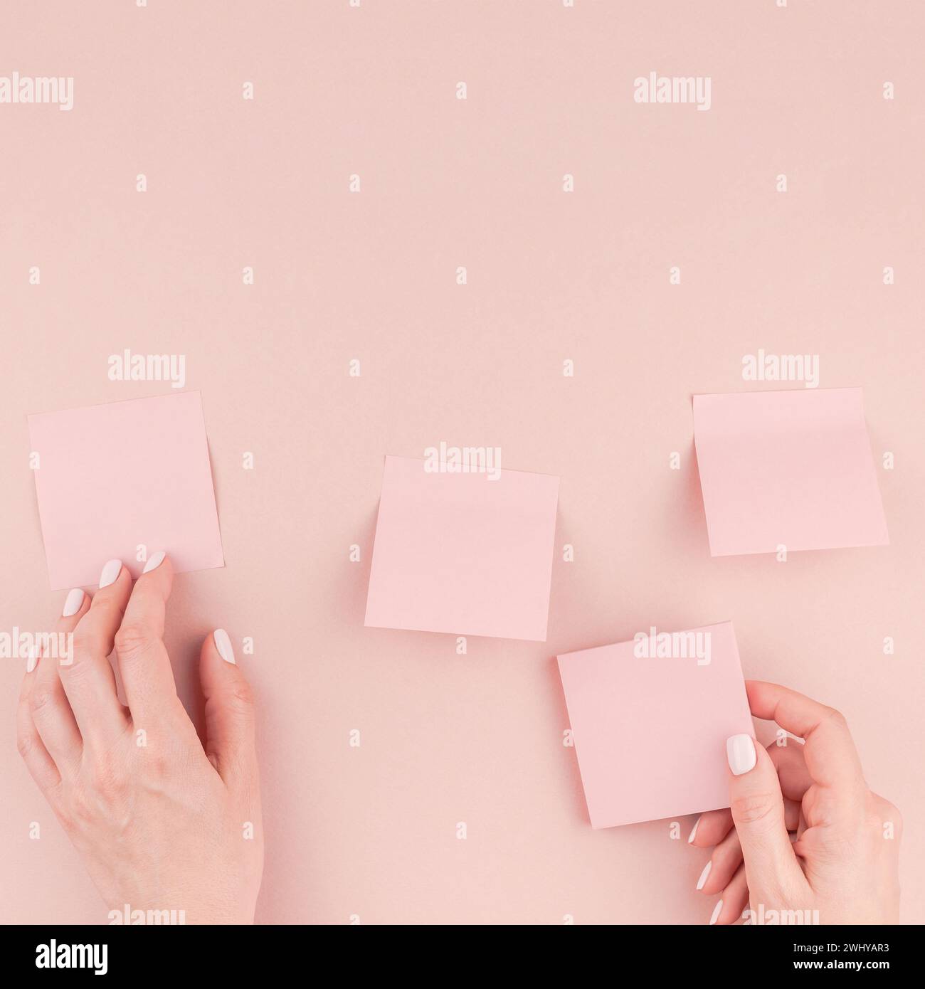 Woman hands with paper stickers Stock Photo - Alamy