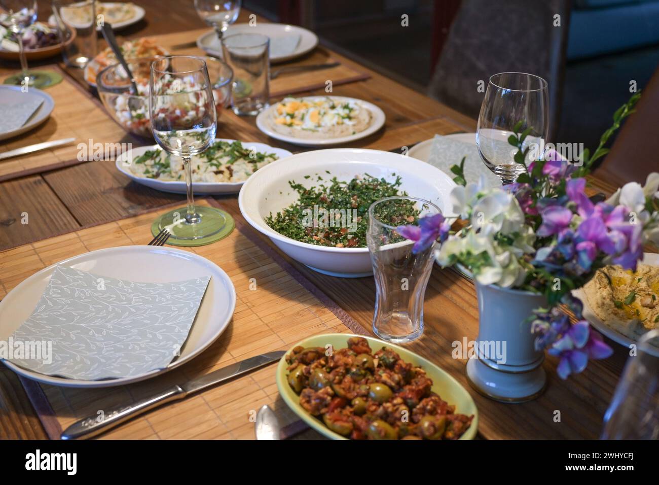 Set rustic wooden table with various homemade salads and appetizers for ...