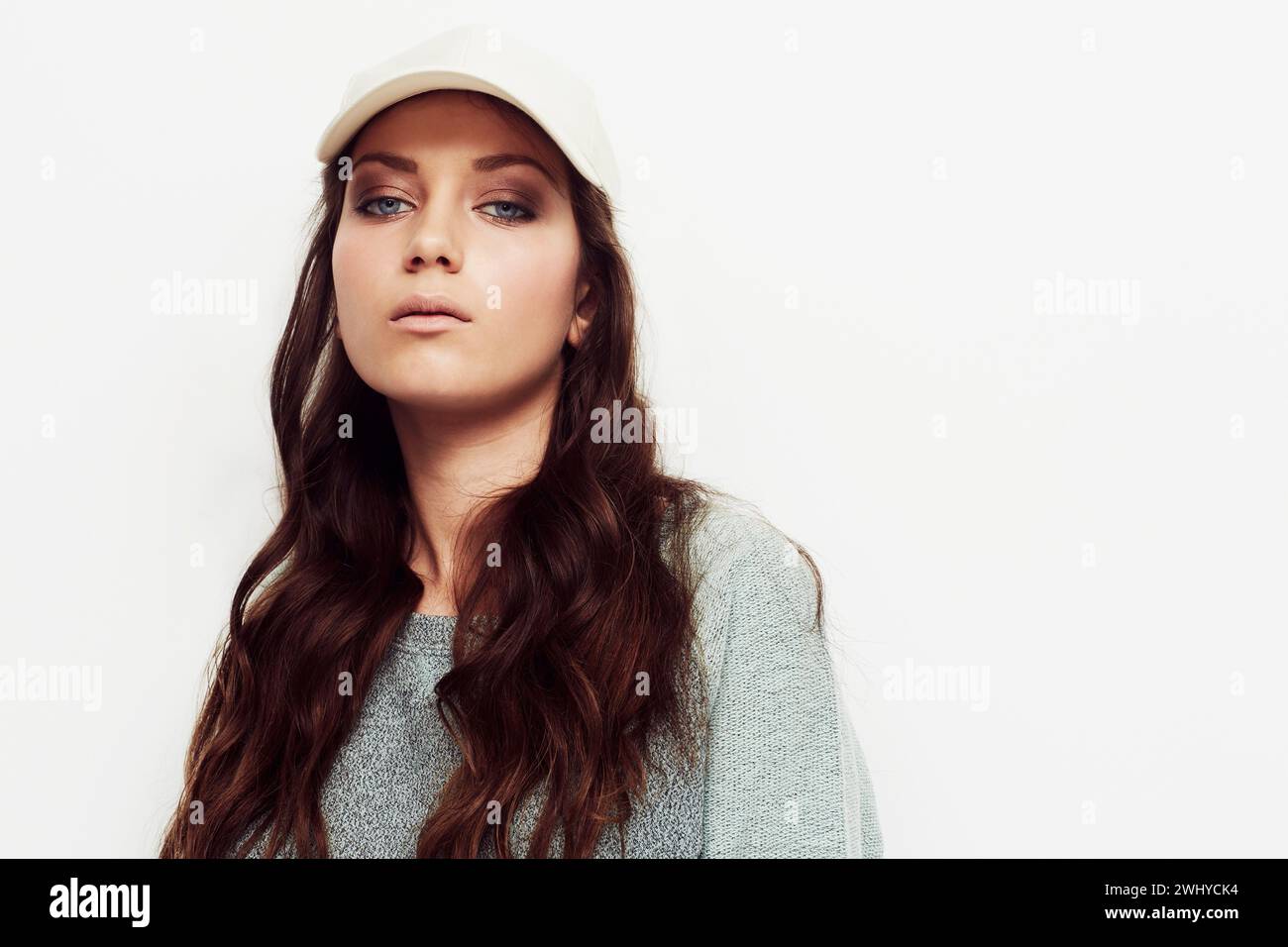 Cap, fashion and woman portrait in studio with attitude, confidence and ...