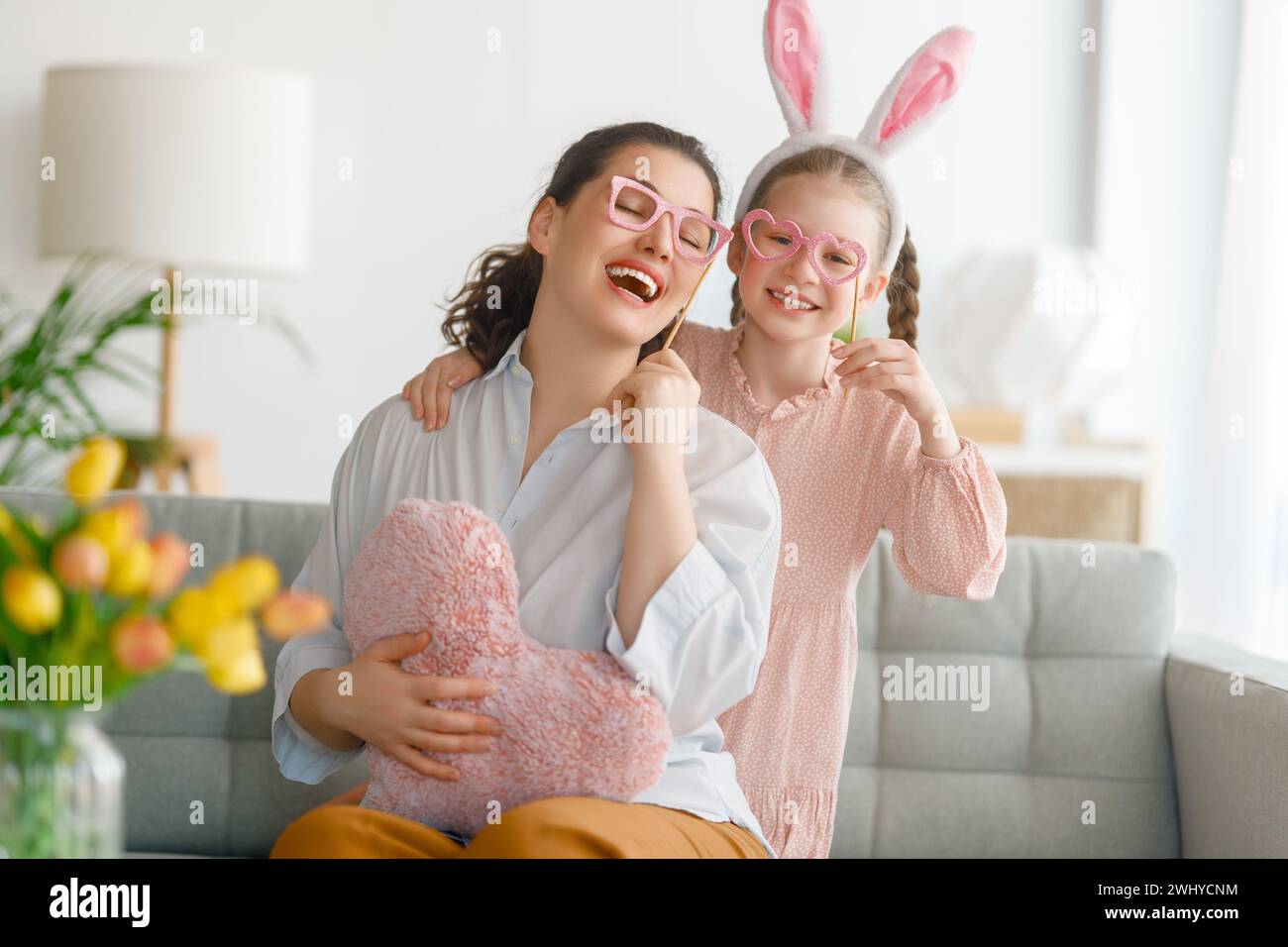 Happy holiday. Mother and her daughter. Family celebrating Easter. Cute ...