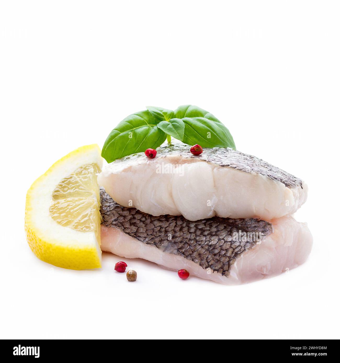 Hake fillet with skin and lemon Stock Photo - Alamy
