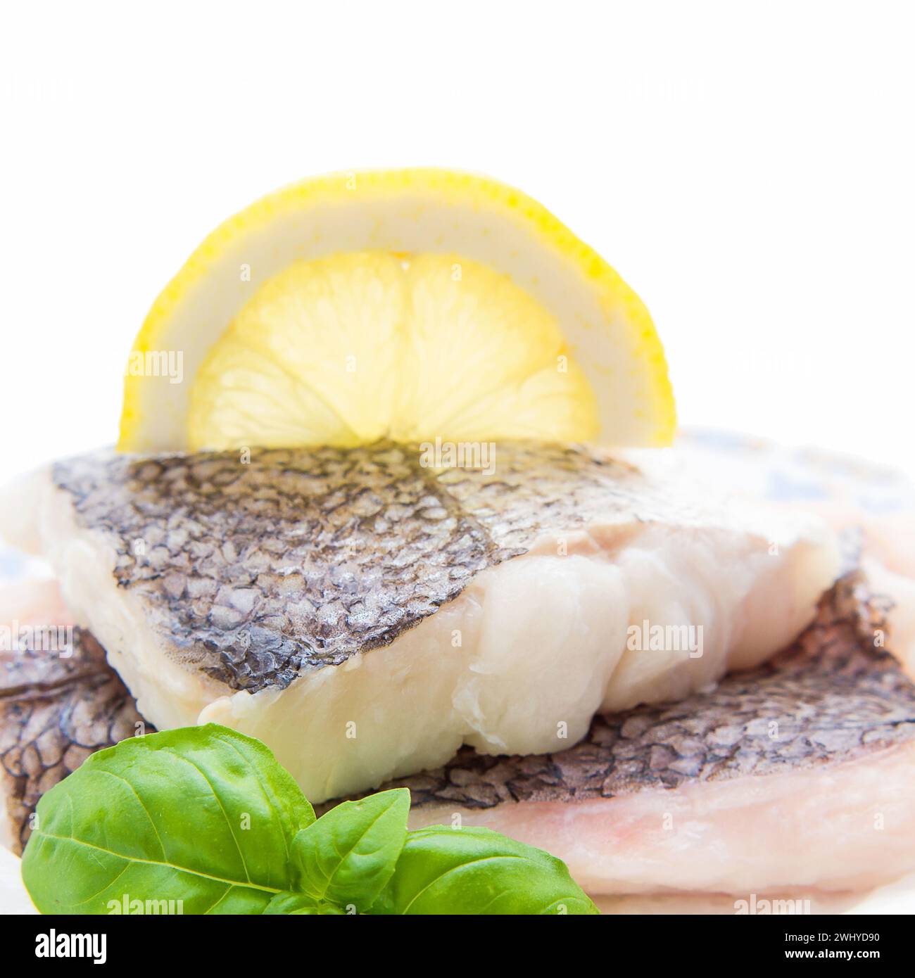 Hake fillet with skin and lemon, macro Stock Photo - Alamy