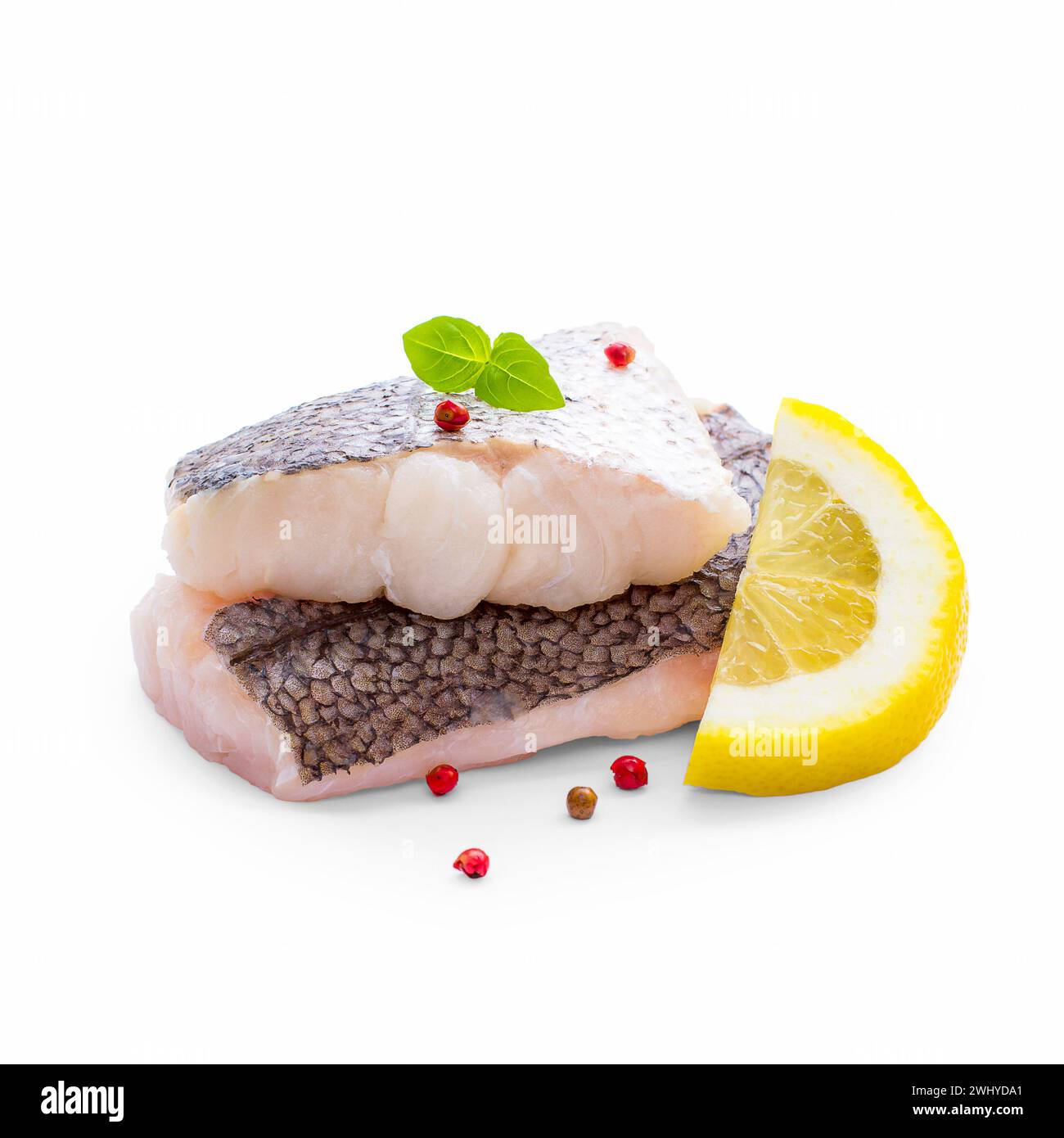Hake fillet with skin and lemon, isolated Stock Photo - Alamy