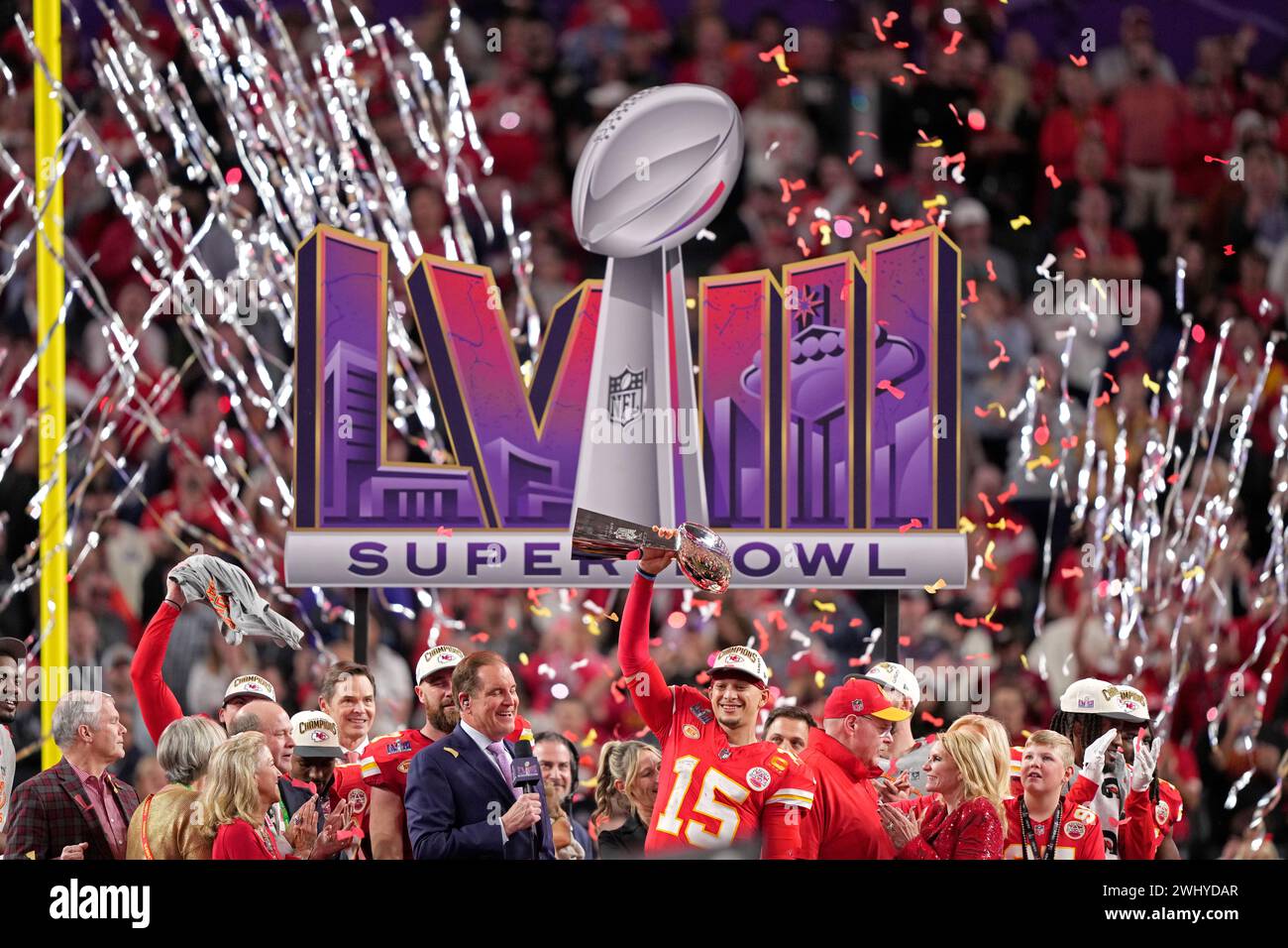 Patrick Mahomes raises the Lombardi Trophy over his head after the ...