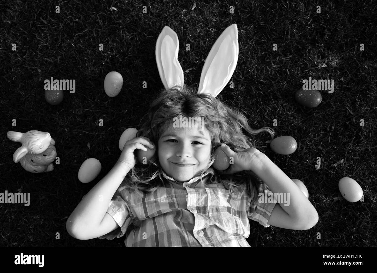 Bunny boy hunting eggs in park, Funny little Easter bunny child hunt ...