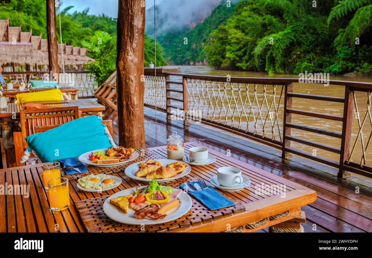 Breakfast table at a tropical beach houses on the River Kwai in ...