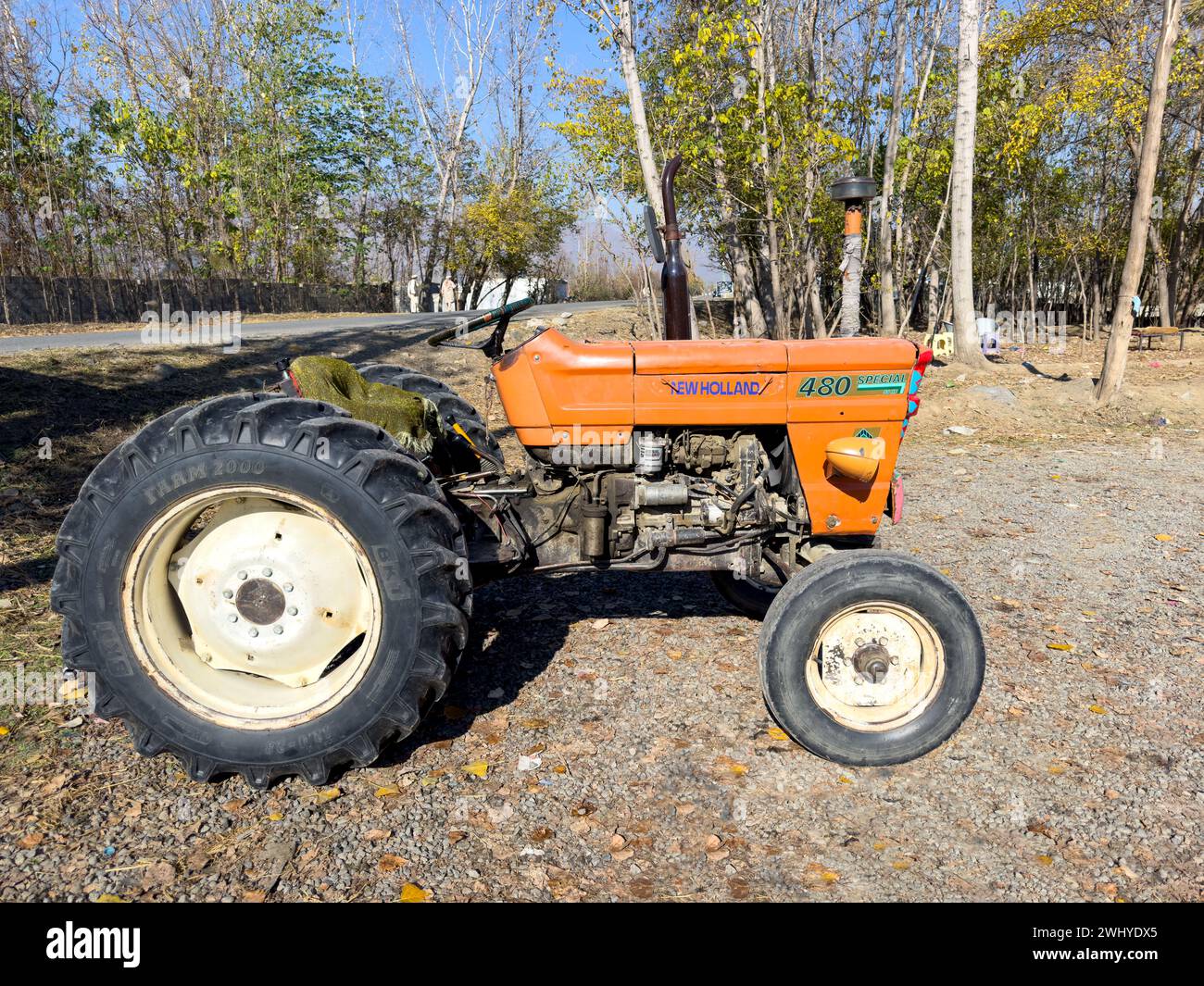 Beautiful view orange tractor hi-res stock photography and images - Alamy
