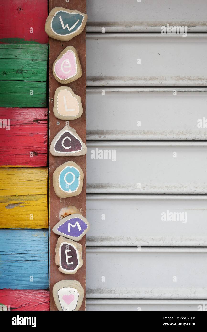 welcome hand written text on hanging on cafe door Stock Photo - Alamy