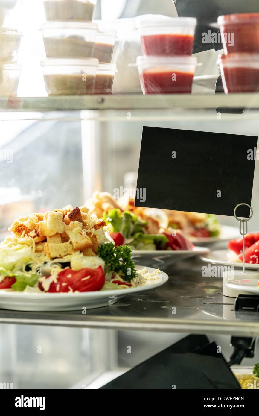 Showcase with salads in the dining room or cafeteria Stock Photo - Alamy
