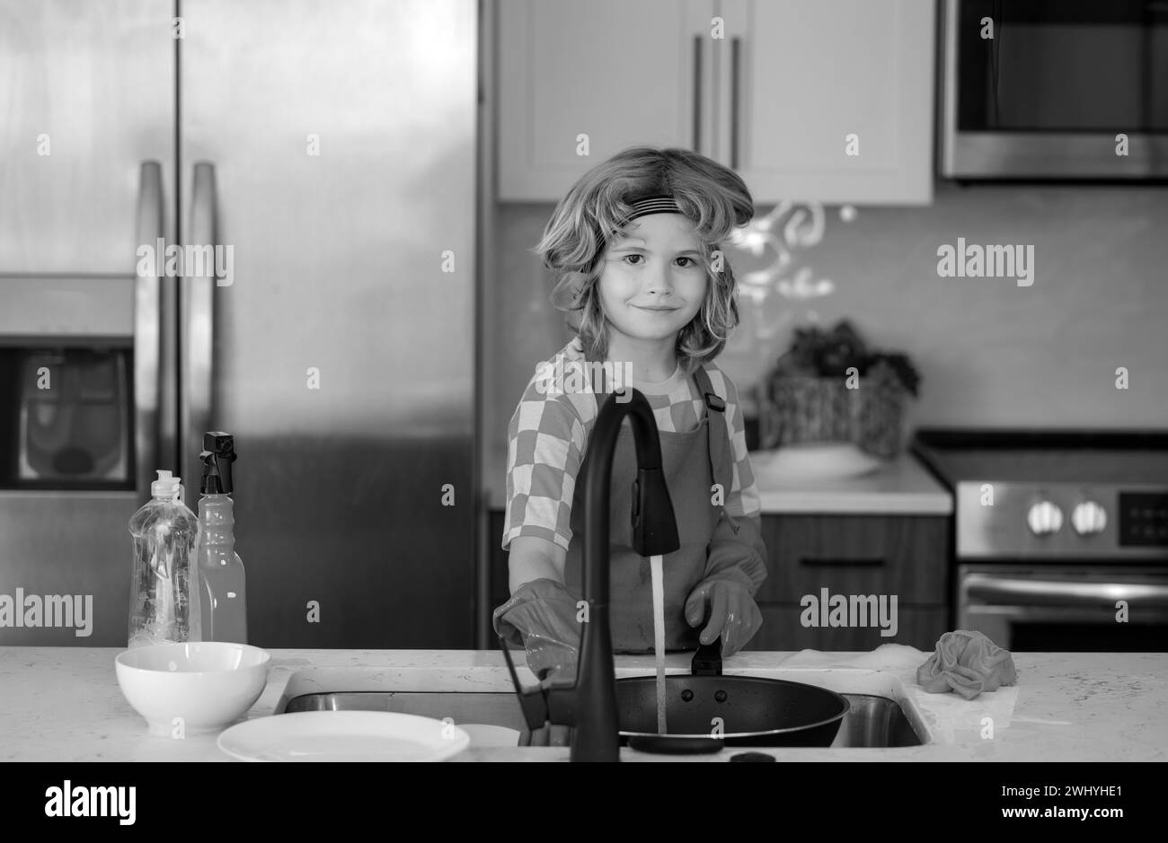 Adorable little helper child housekeeping. Little cute boy sweeping and ...