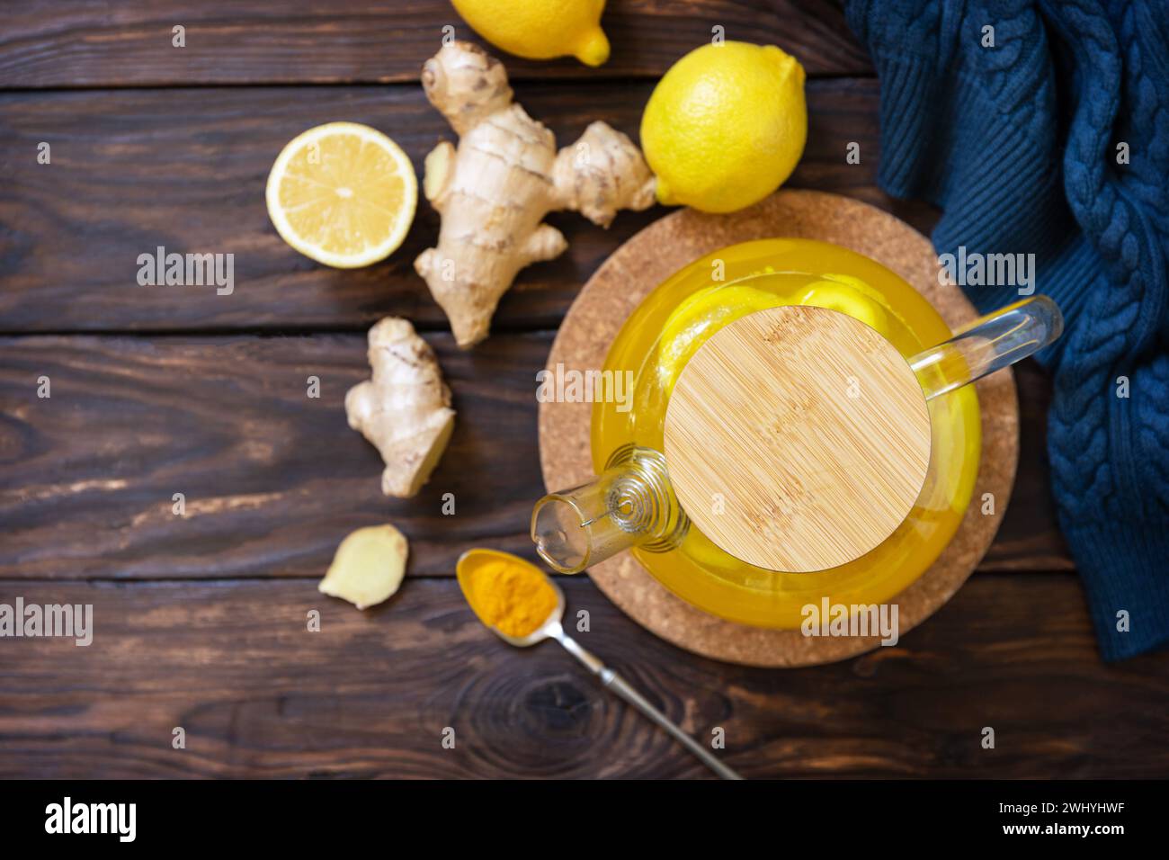 Healthy turmeric hot drink tea with lemon, ginger and honey on rustic ...