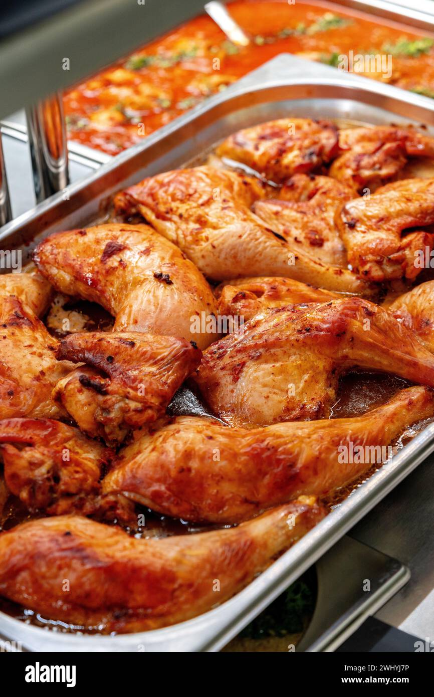 Metal tray with fresh baked chicken in a canteen Stock Photo - Alamy
