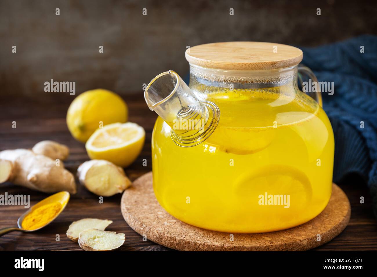 Healthy turmeric hot drink tea with lemon, ginger and honey on rustic ...