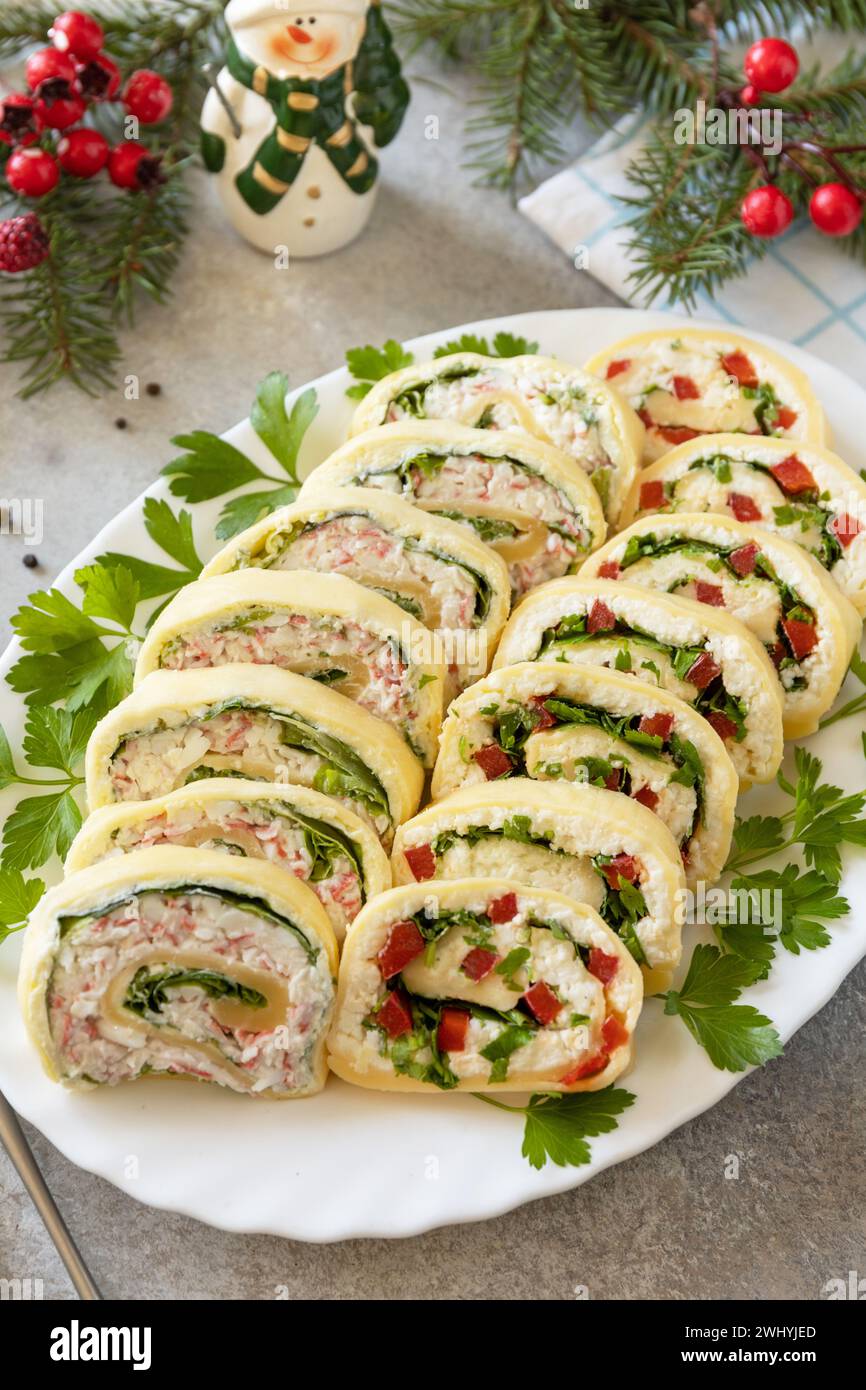 Creative appetizers christmas. Cheese rolls with crab sticks, cream ...