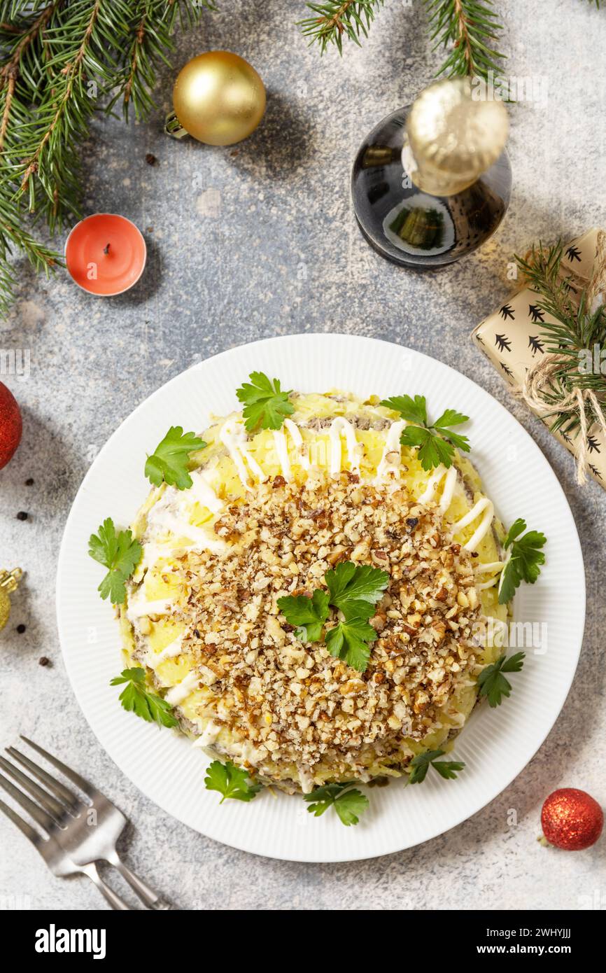 Christmas appetizer. Christmas New Year salad with potatoes, liver and ...
