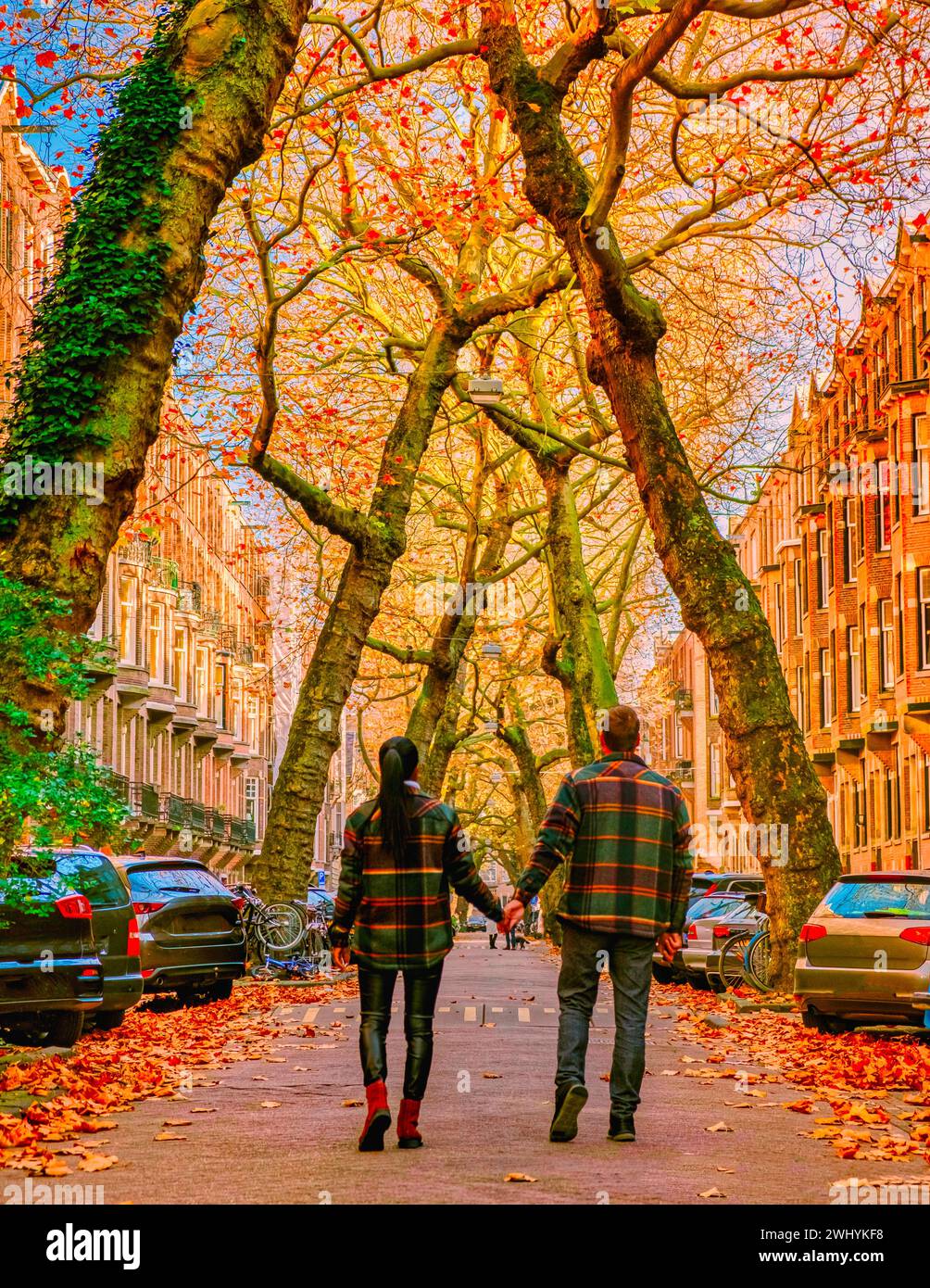 Amsterdam Netherlands during Autumn fall season , couple men and woman visit the city of ...