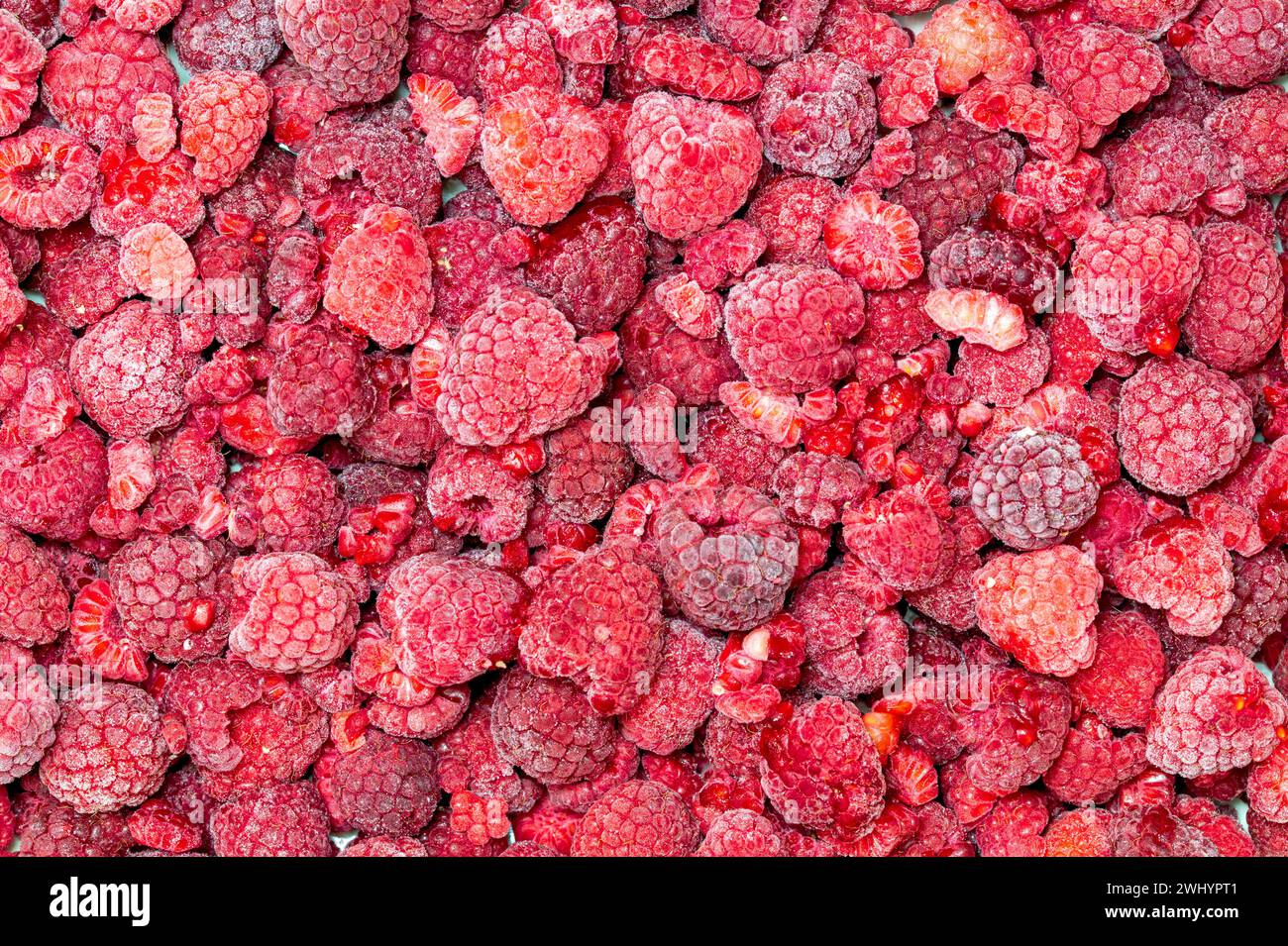 Frozen raspberries background texture. View from above on frozen ...