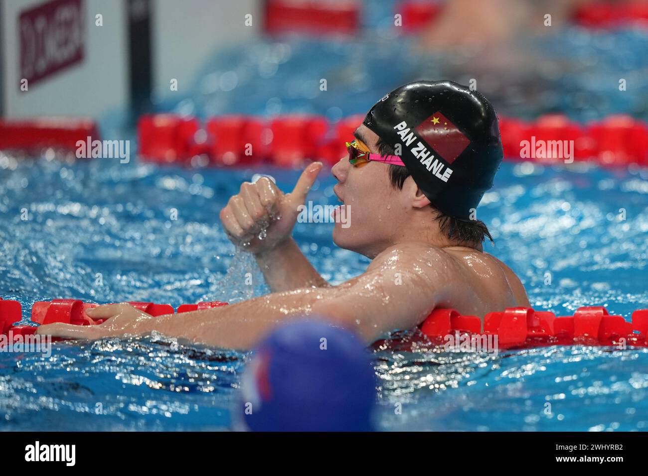 Doha, Qatar. 11th Feb, 2024. Pan Zhanle of Team China celebrates after ...