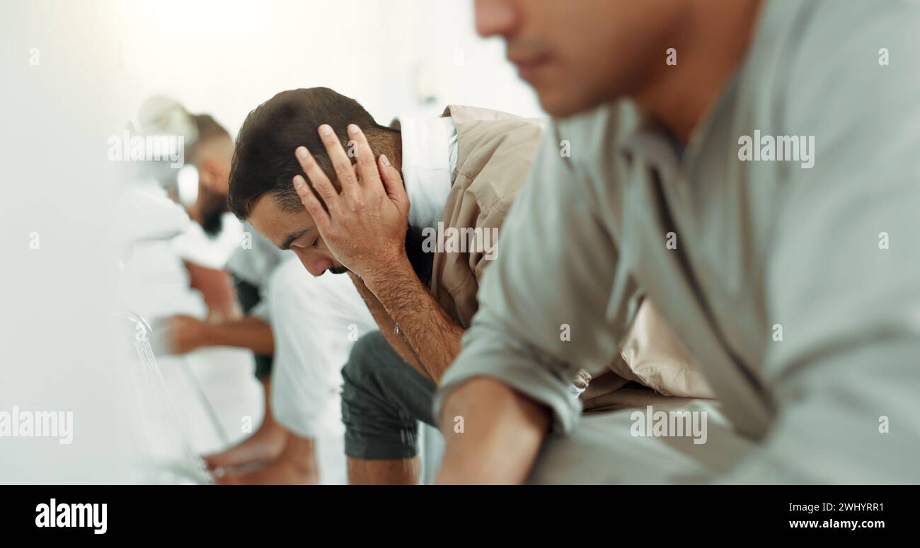 Muslim, religion ritual and men washing before prayer in bathroom for ...